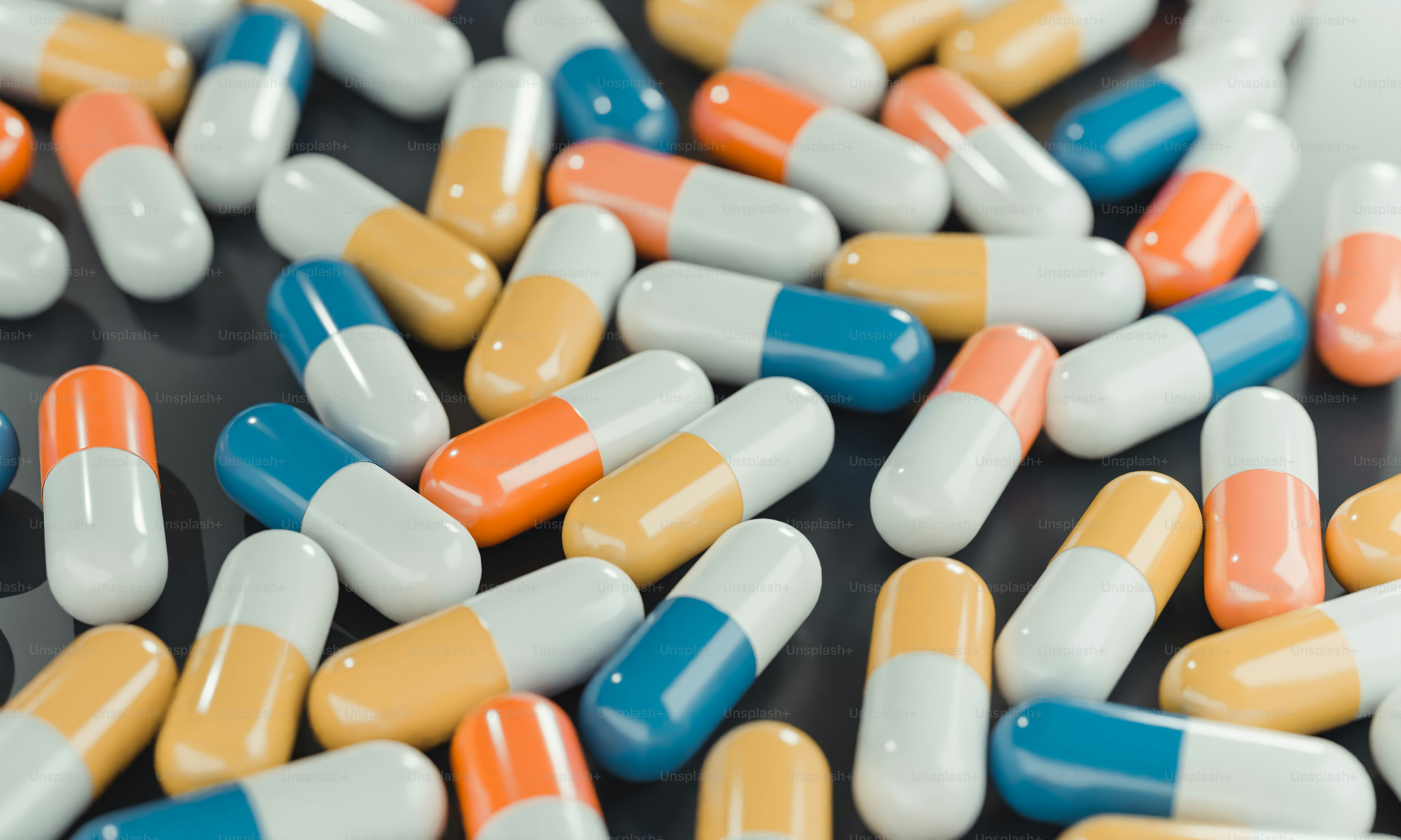 A group of pink and white pills photo – Supplements Image on Unsplash