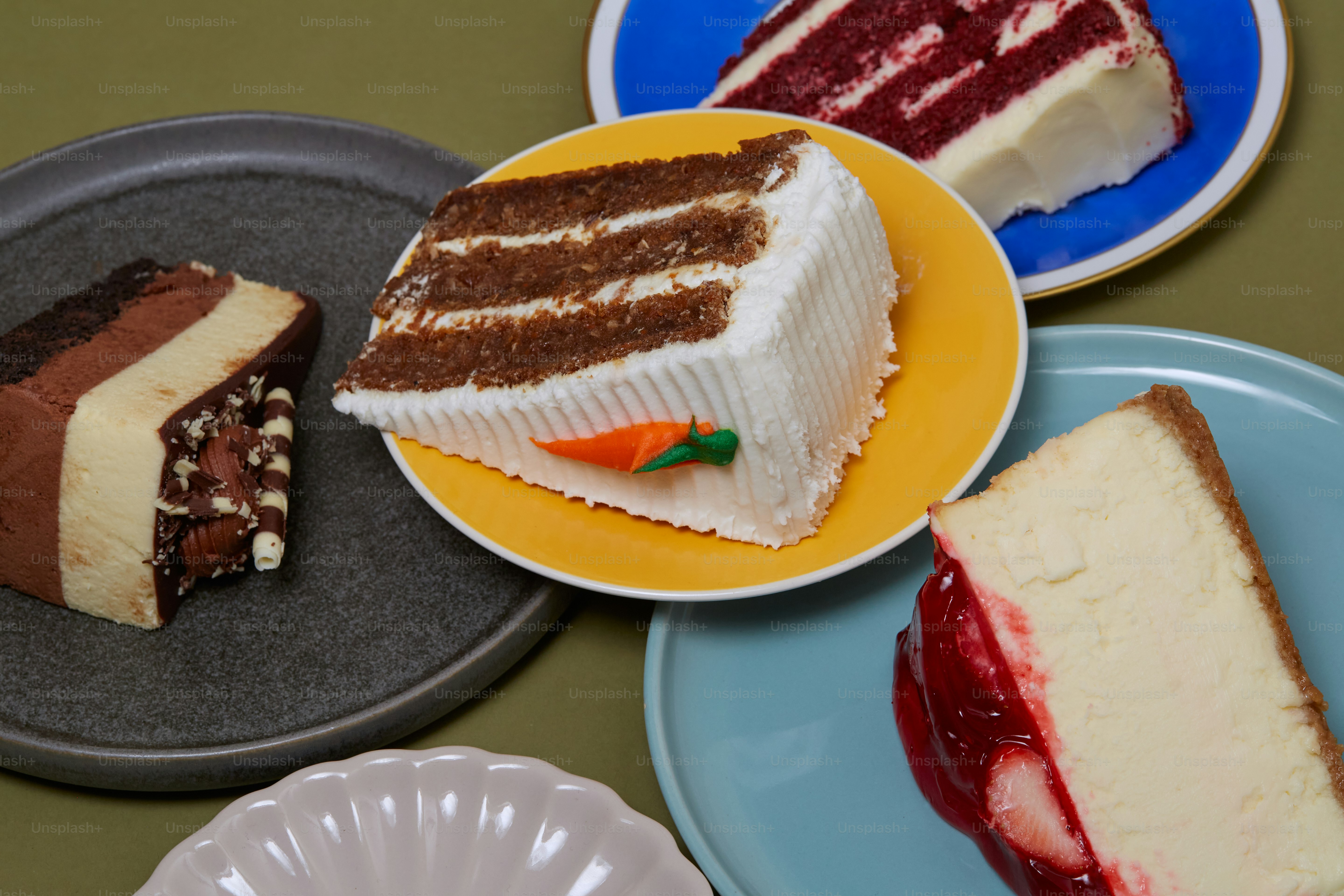 A group of cakes on plates photo – Party Image on Unsplash