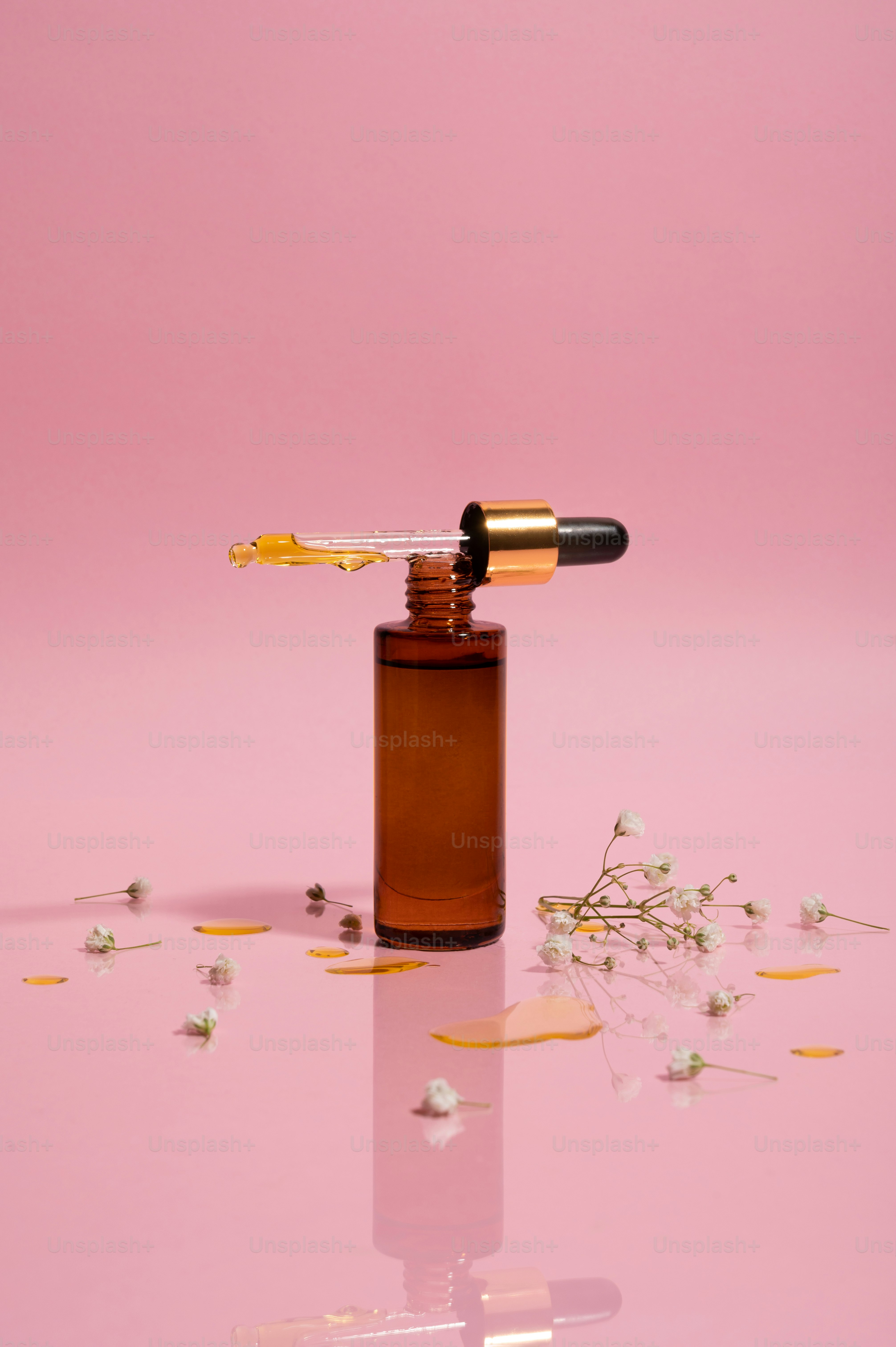 A small light bulb with a few small objects around it photo – Cosmetic ...