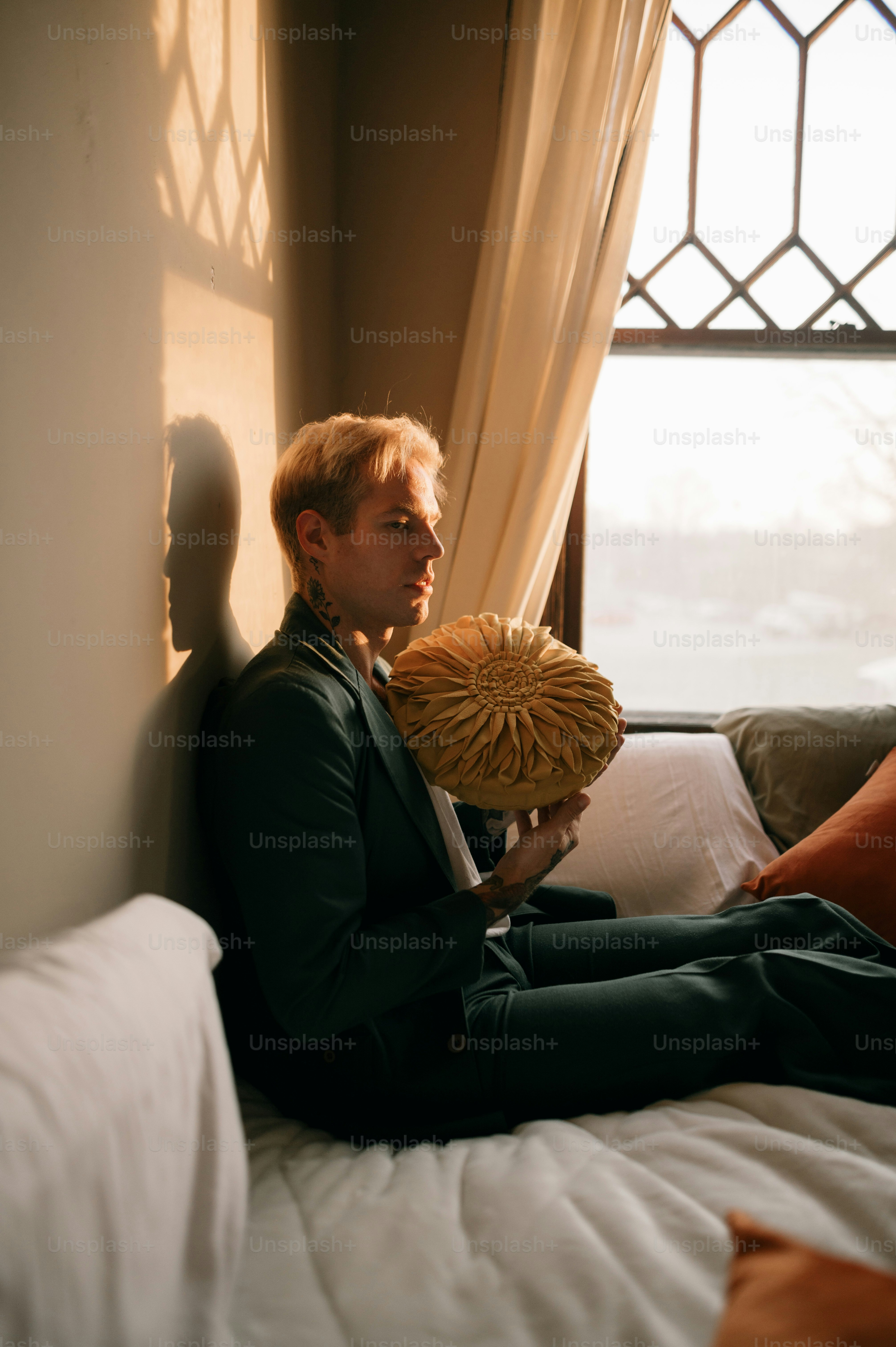 A man jumping in the air on a bed photo – Awake Image on Unsplash