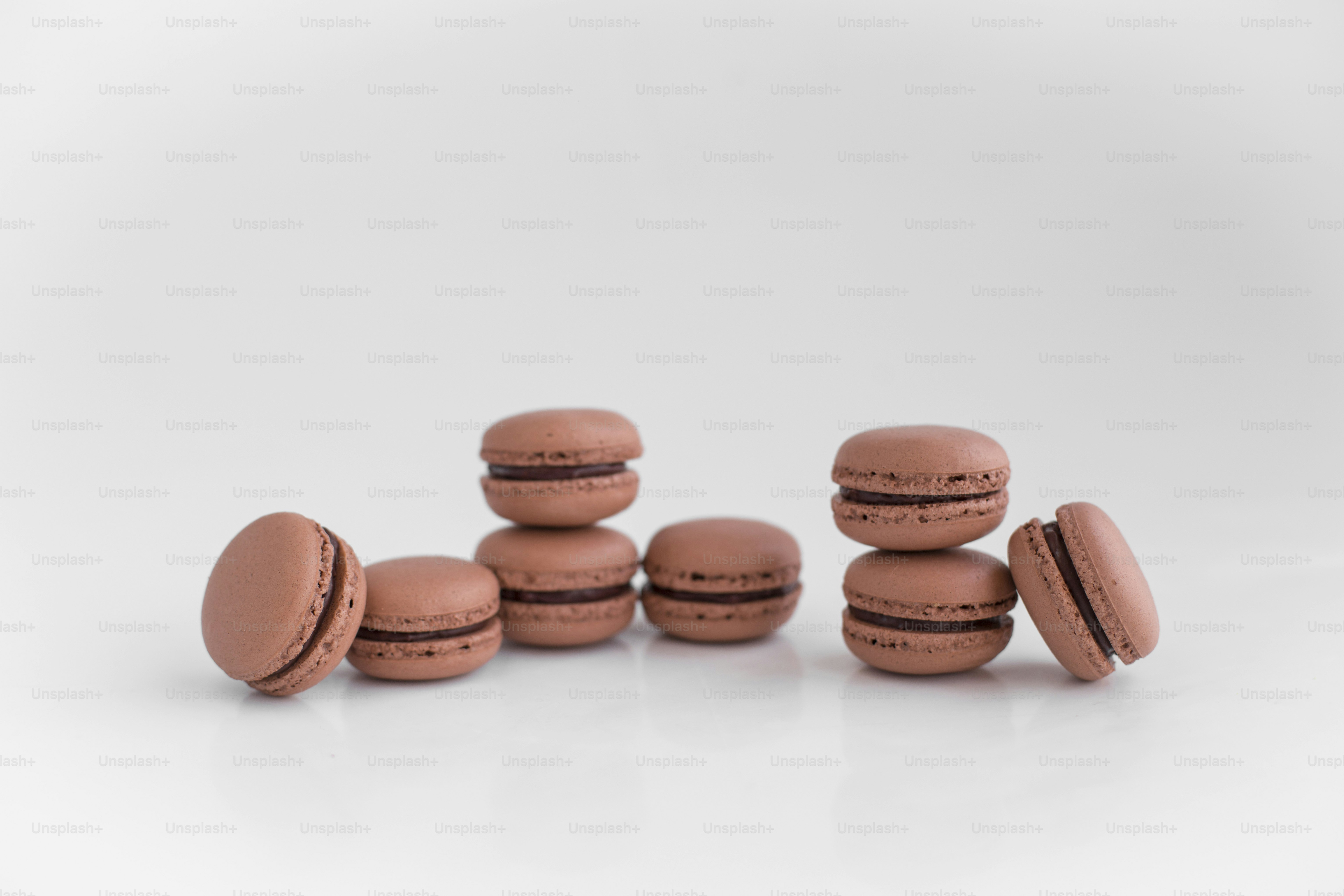 A pile of pink macaroons sitting on top of each other photo ...
