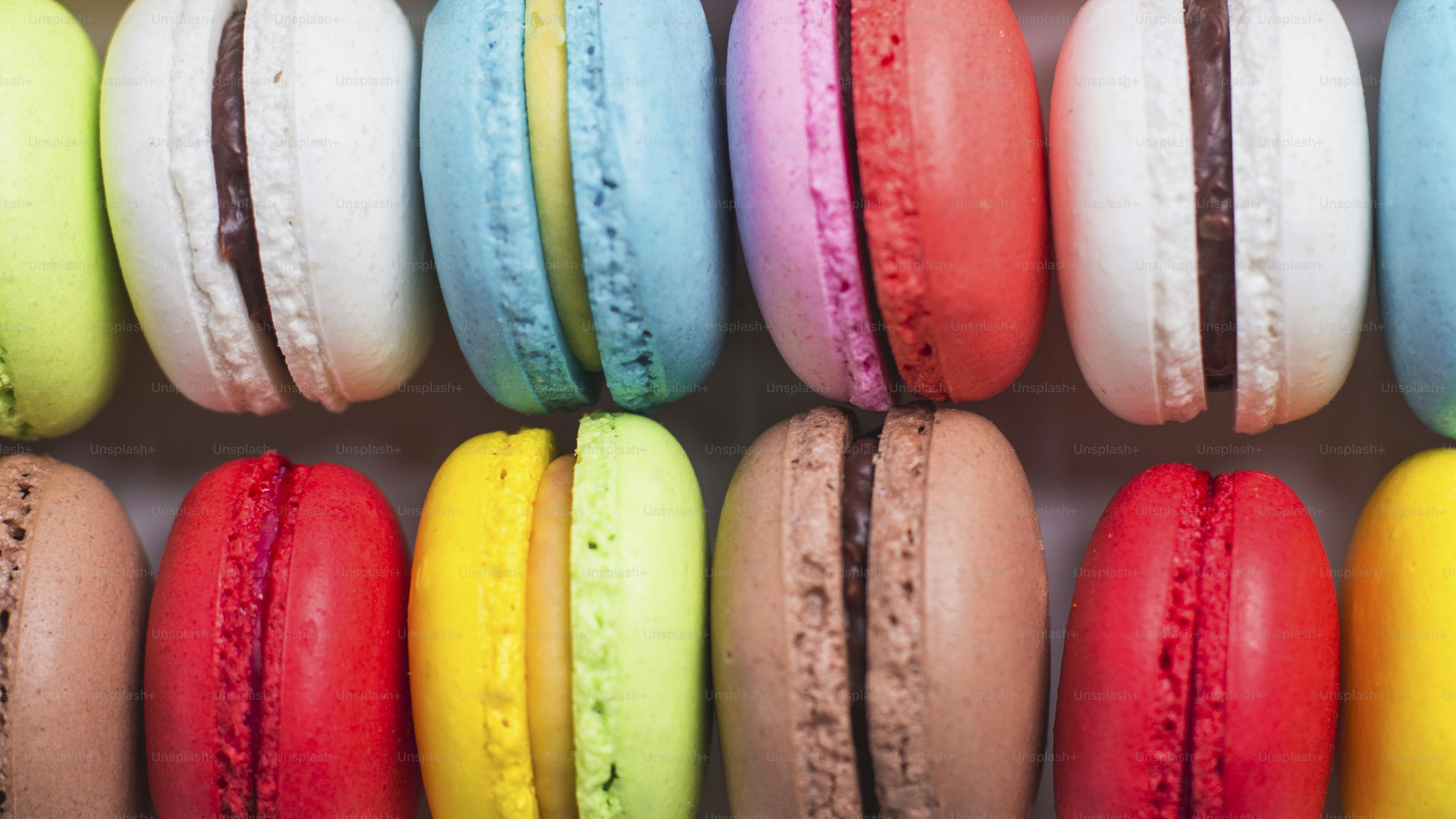 A bunch of colorful macaroons lined up in a row photo – Macaroons Image ...