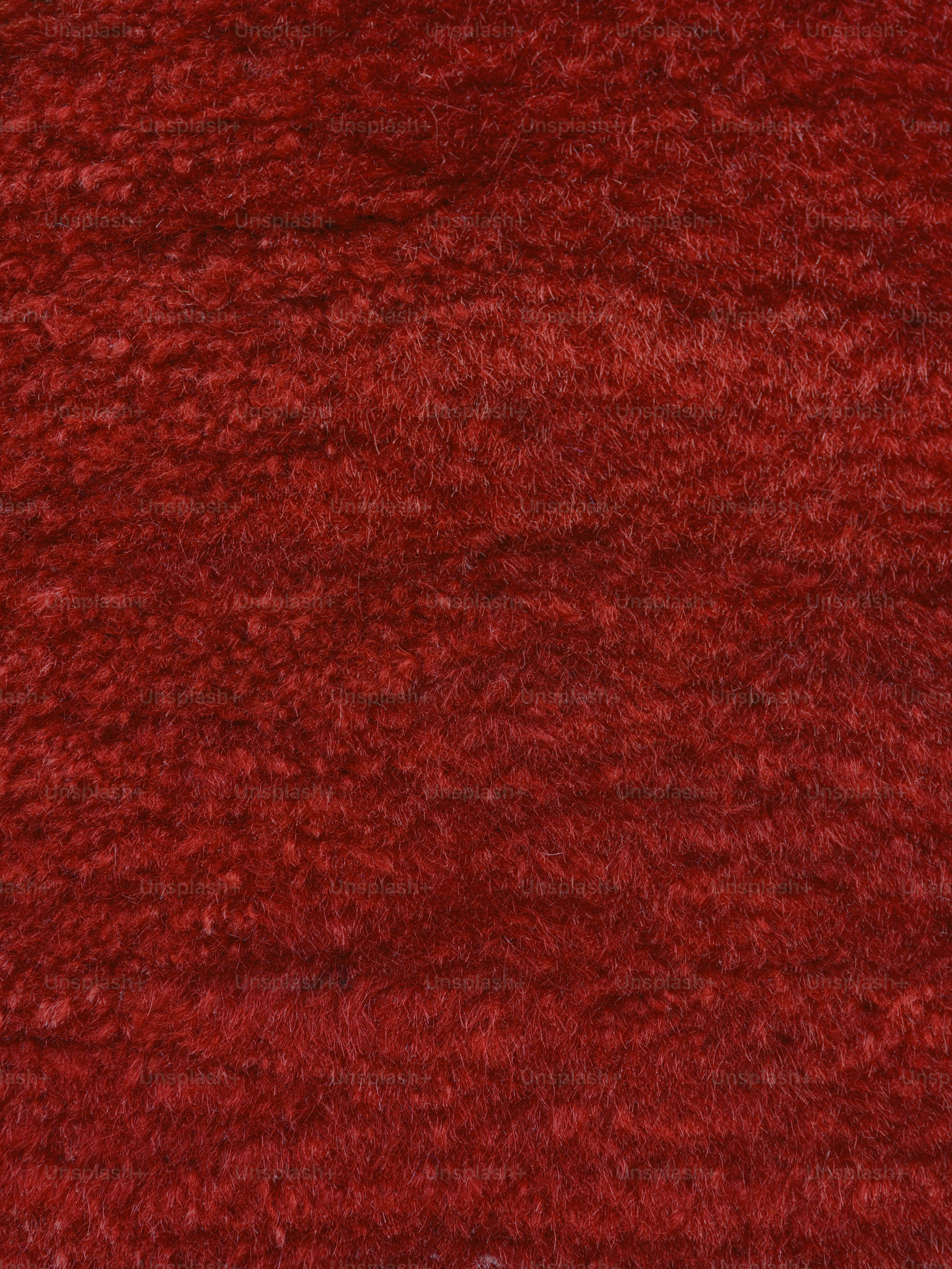 A close up of a red area rug photo – Texture Image on Unsplash