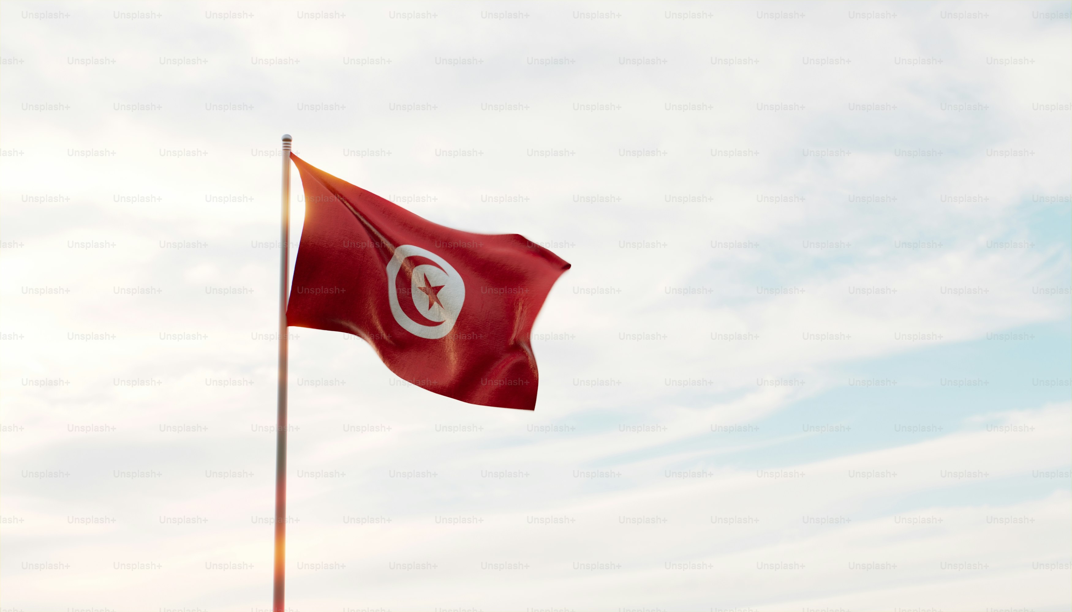 A red flag flying in the wind on a cloudy day photo – Tunisia Image on ...