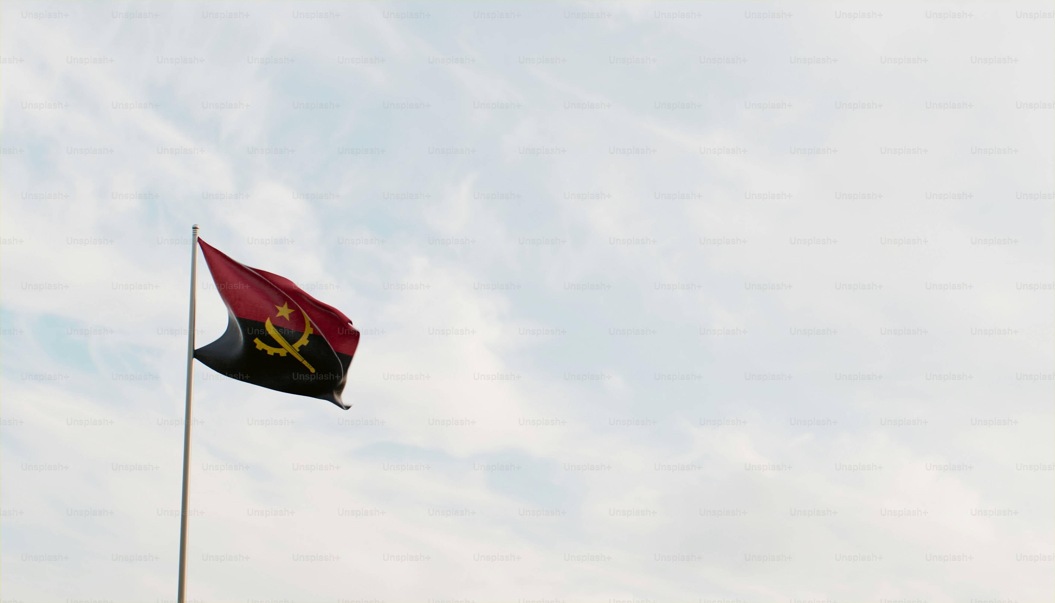 Un drapeau rouge et noir flottant dans le ciel photo – Angola Photo sur ...