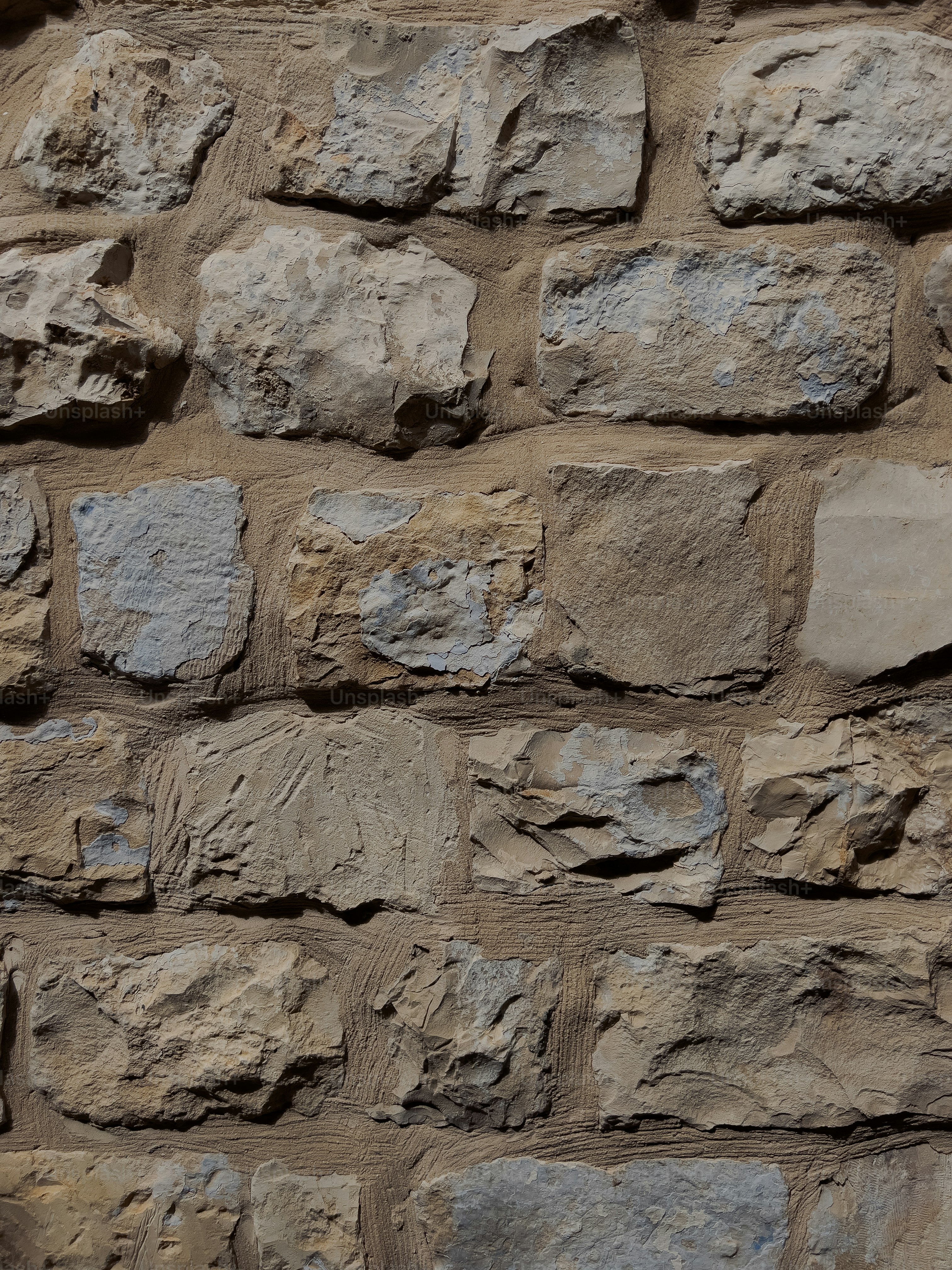 Un gros plan d’un mur fait de roches photo – Arrière-plan du bloc Photo ...