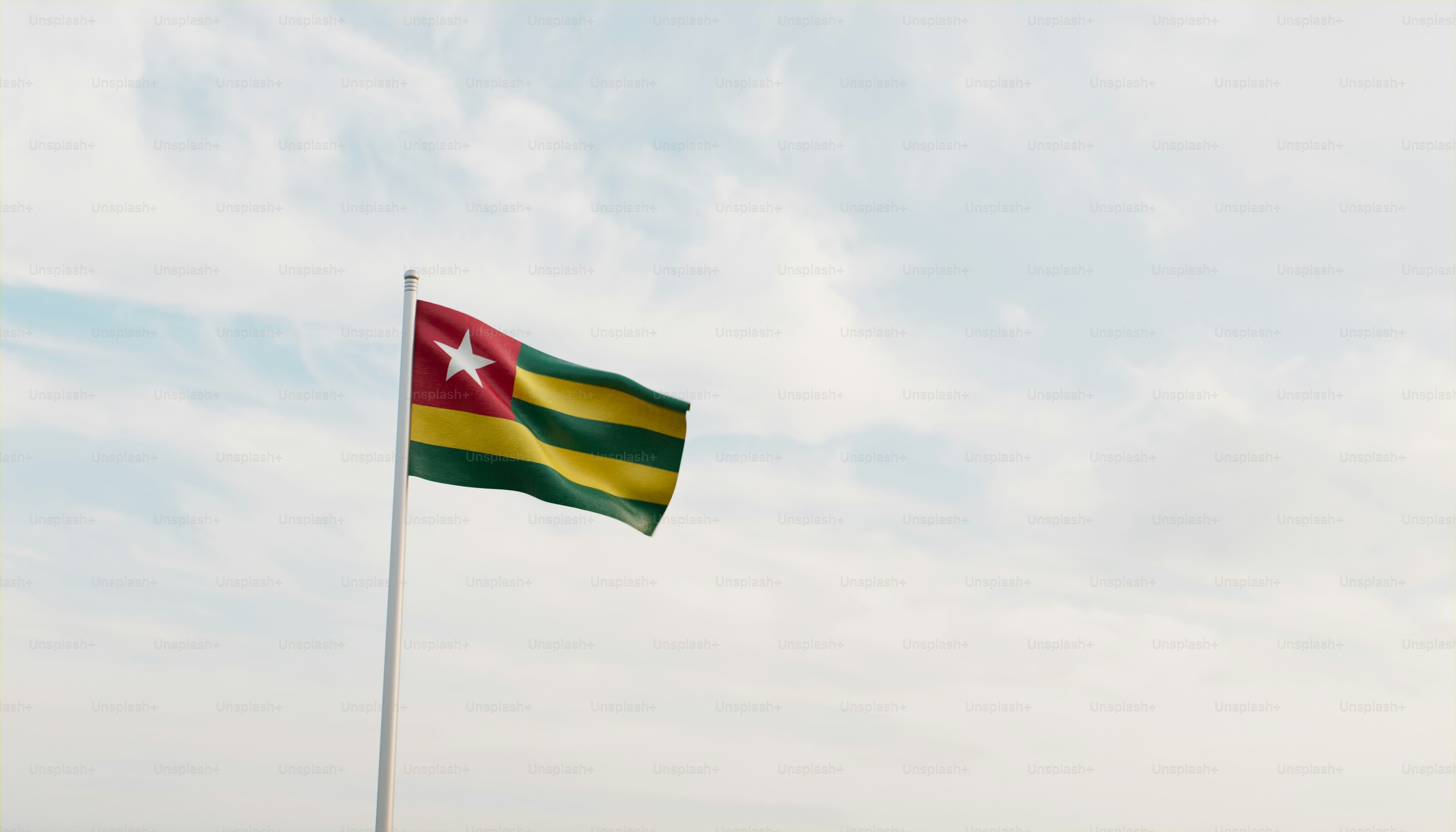 A flag flying in the wind with a sky background photo – Wallpaper Image ...