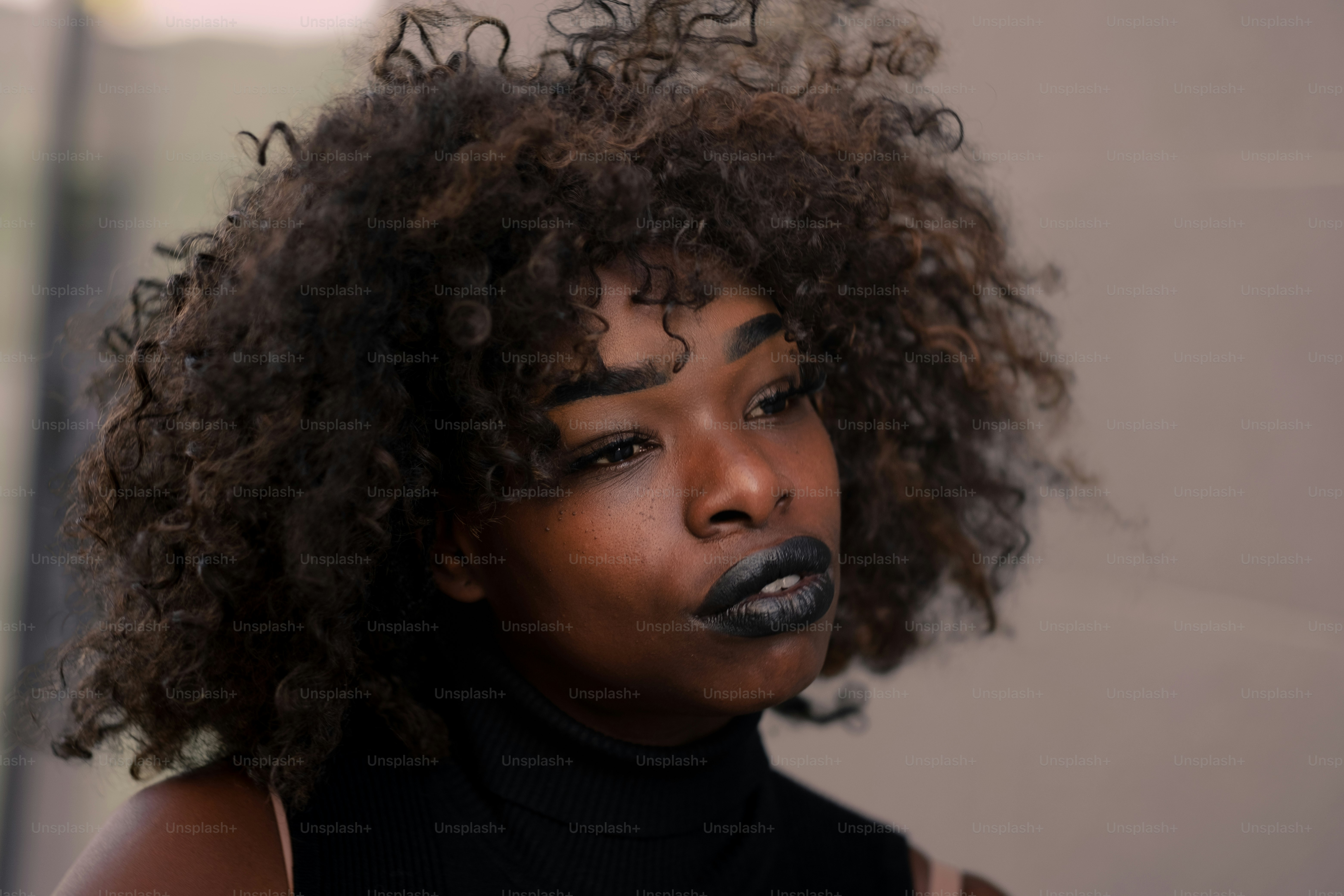 A close up of a person with curly hair photo – Los angeles Image on ...