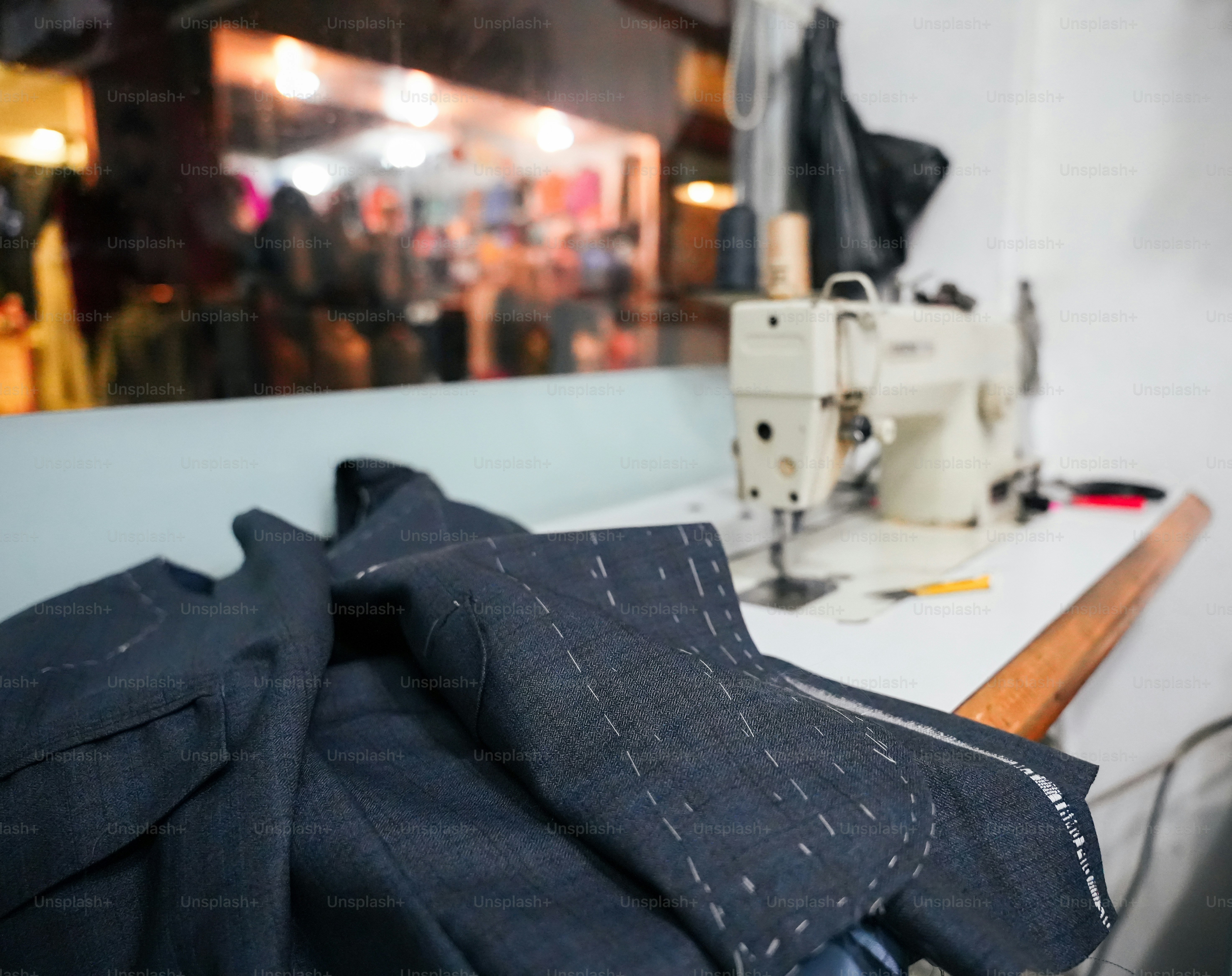 A close up of a sewing machine on a table photo – Tailoring Image on ...