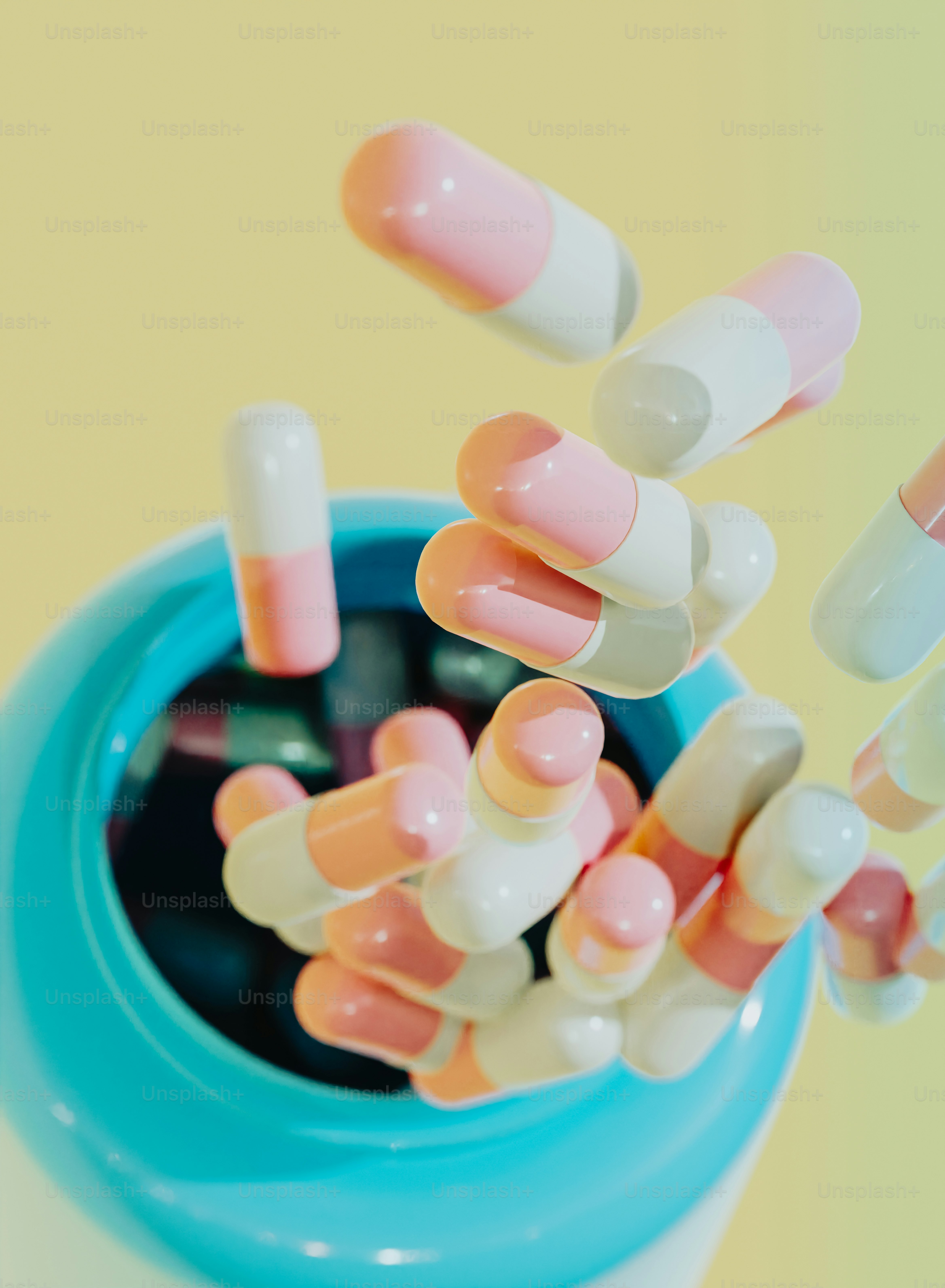 A blue container filled with pills on top of a table photo – Healthcare ...