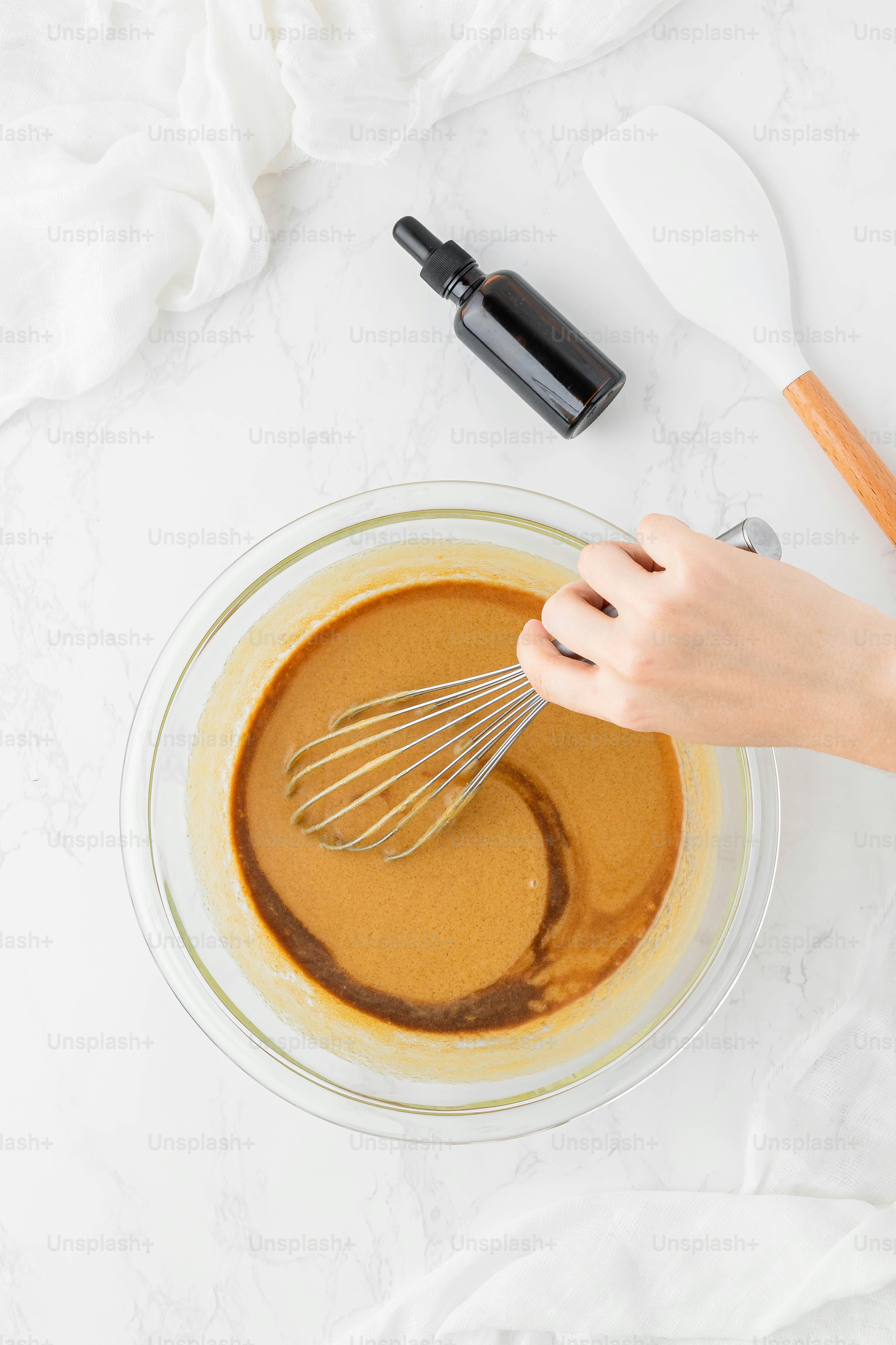 A whisk being whisked in a bowl of liquid photo – Chocolate chip ...