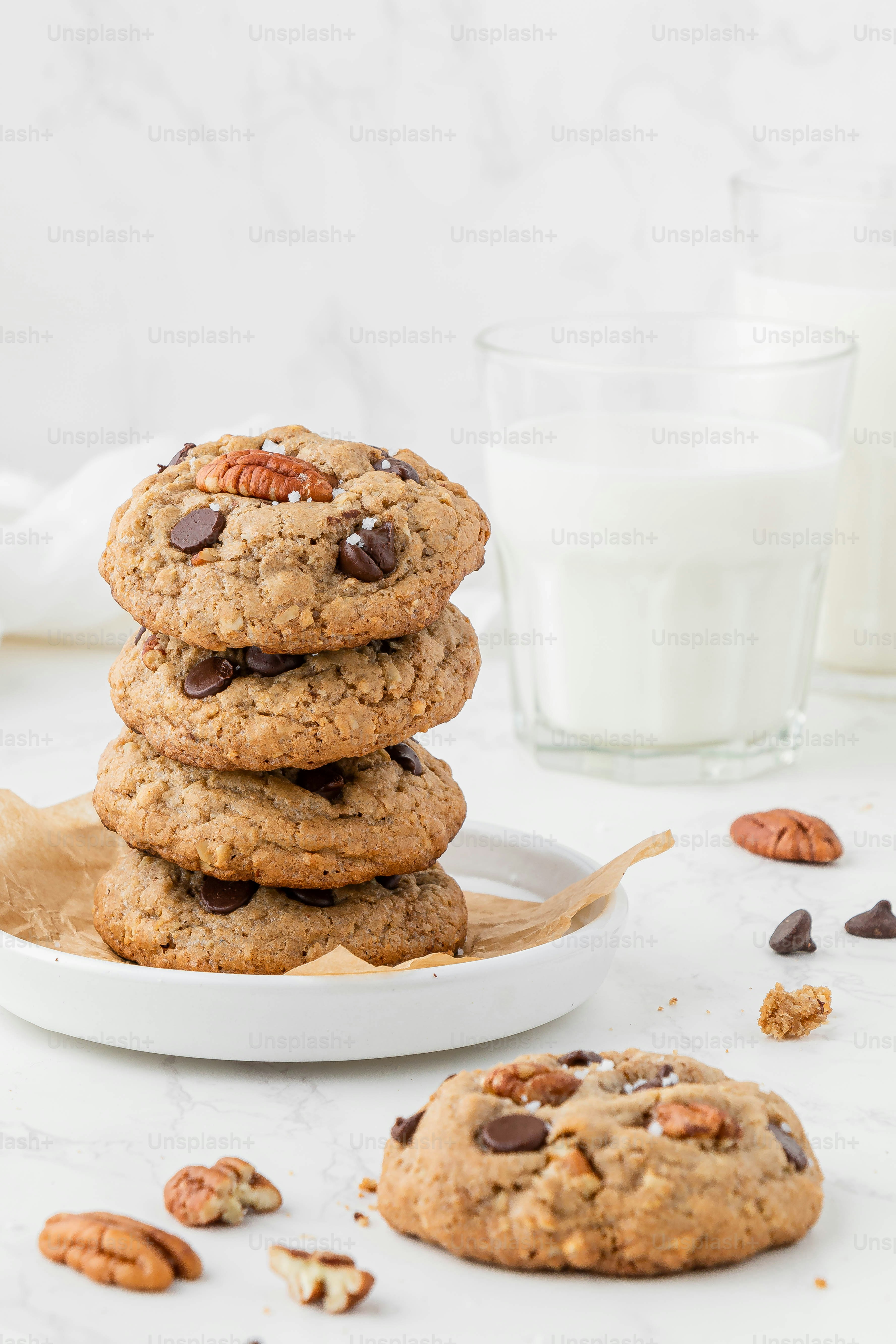 A stack of cookies sitting on top of a white plate photo – Cookies ...