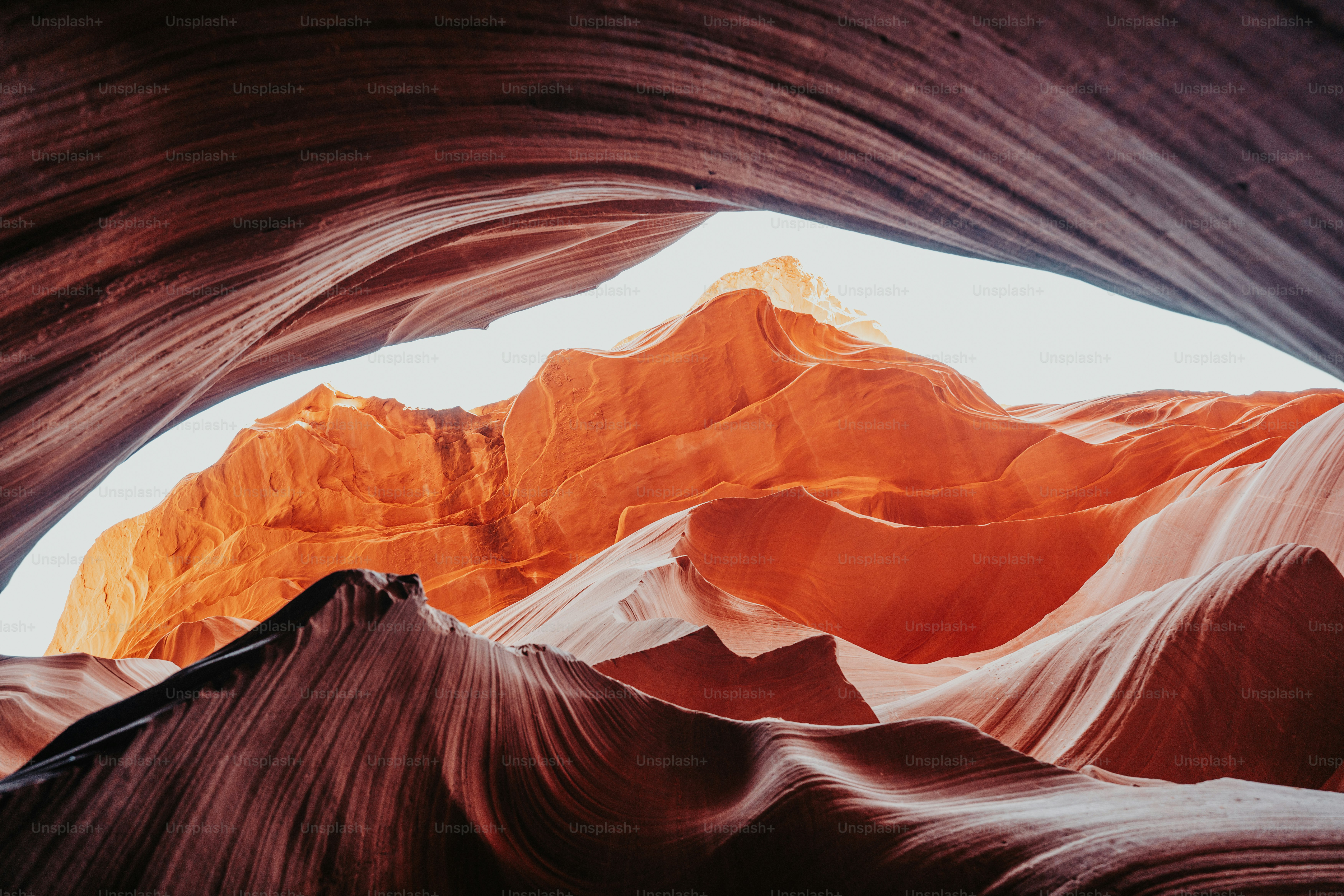 A view from inside a cave looking up at the mountains photo – Antelope ...