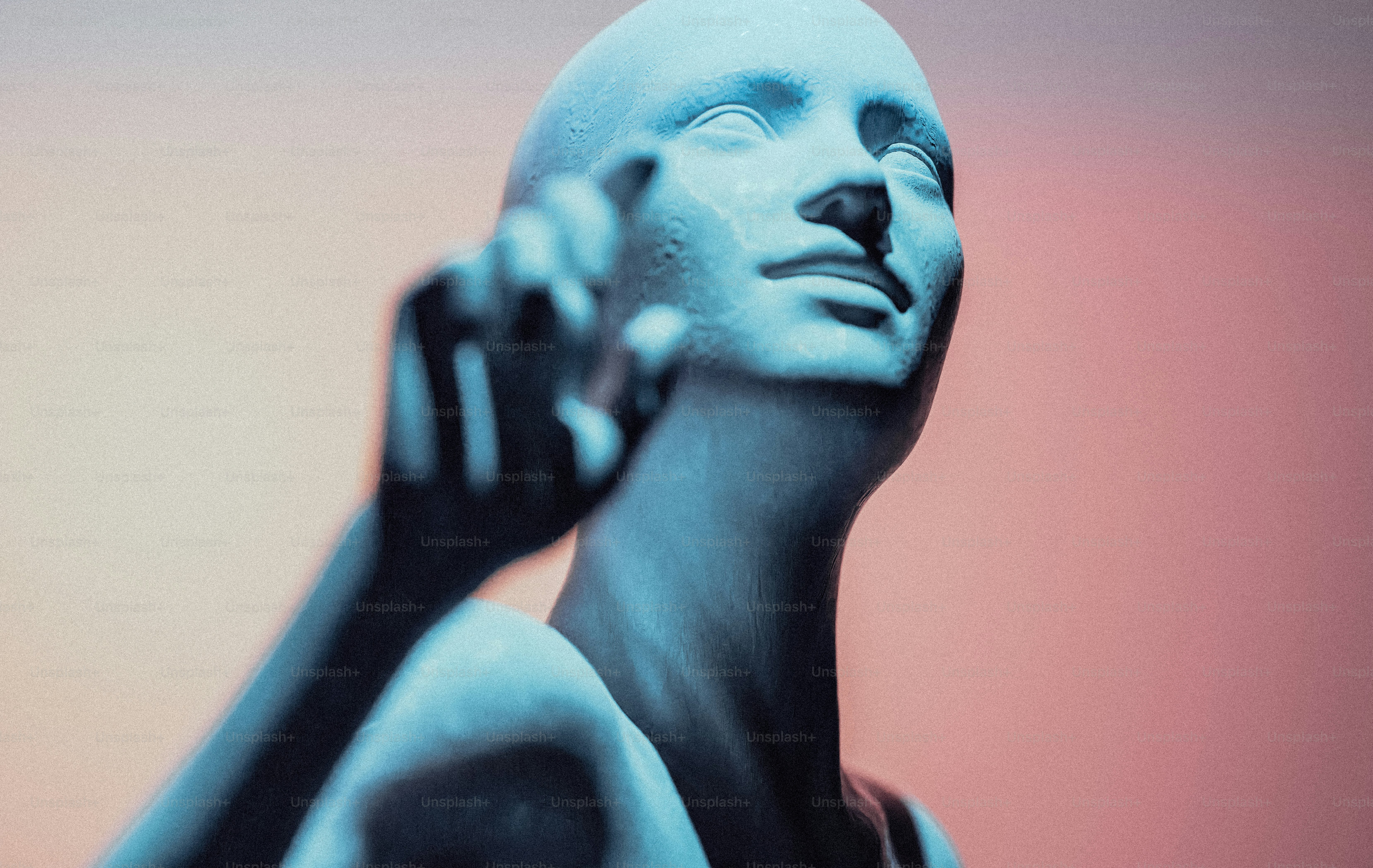 A statue of a person holding a cell phone photo – Digital image Image ...