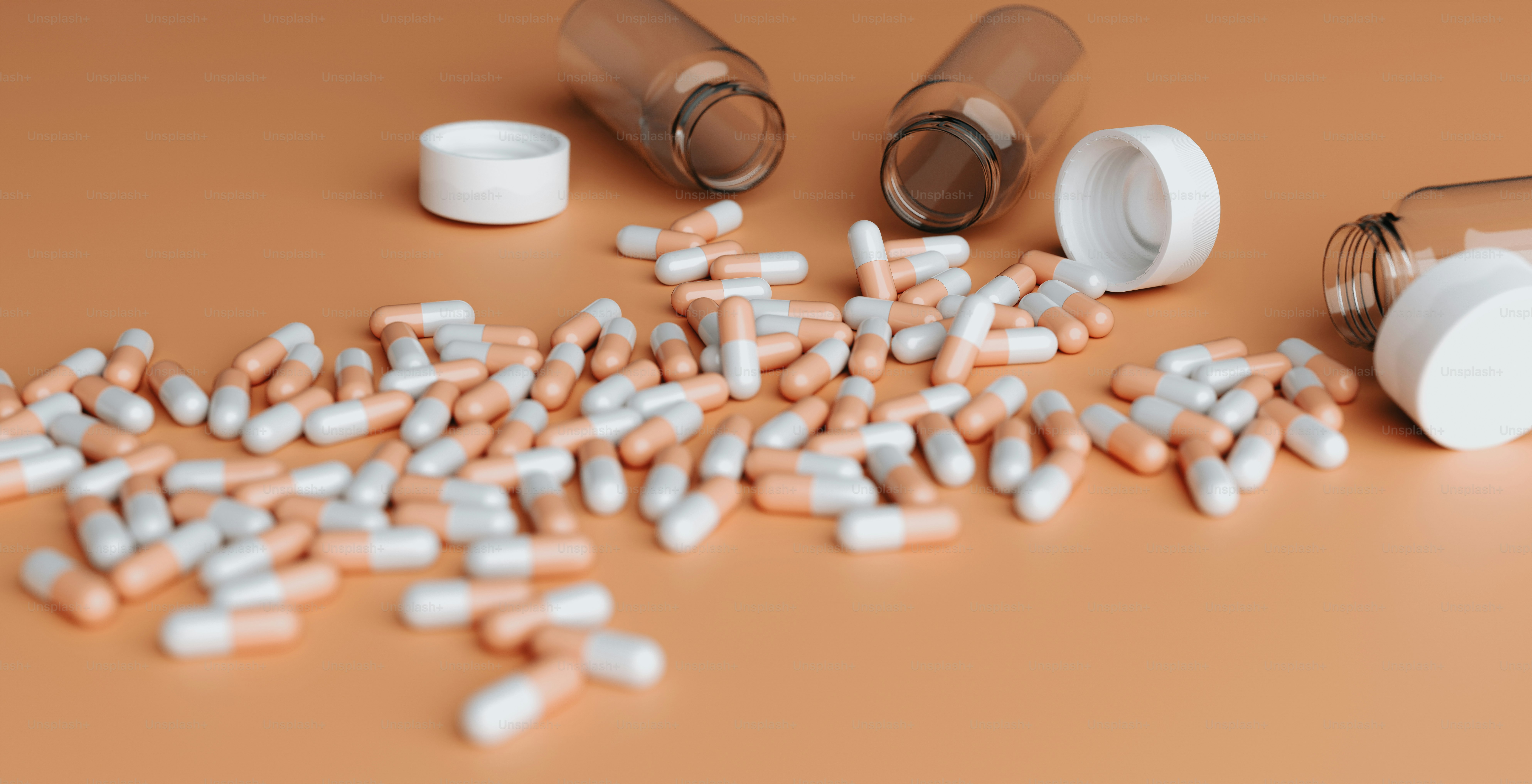 Pills spilling out of a bottle onto a table photo – Medication Image on ...