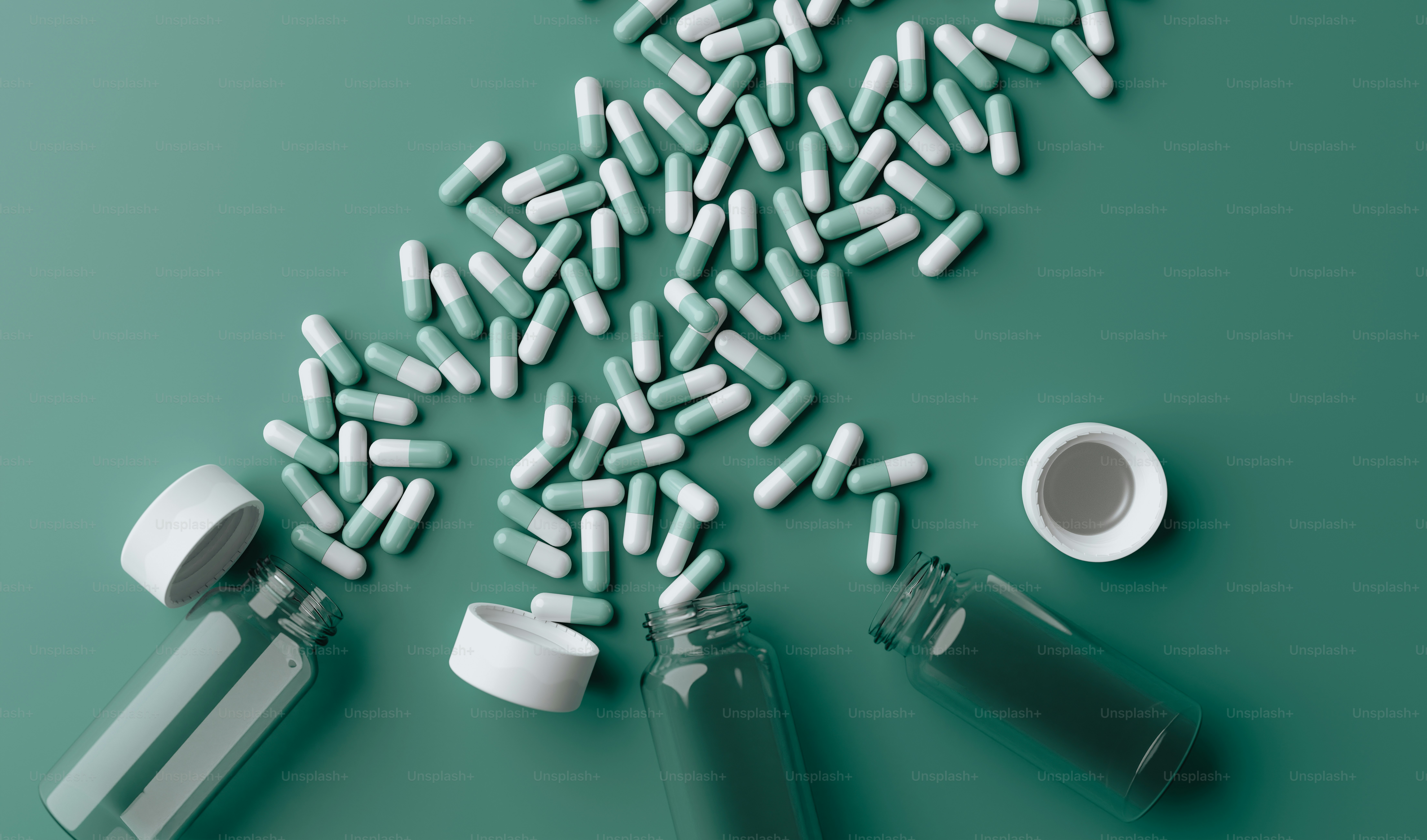 Pills spilling out of a bottle onto a table photo – Health Image on ...
