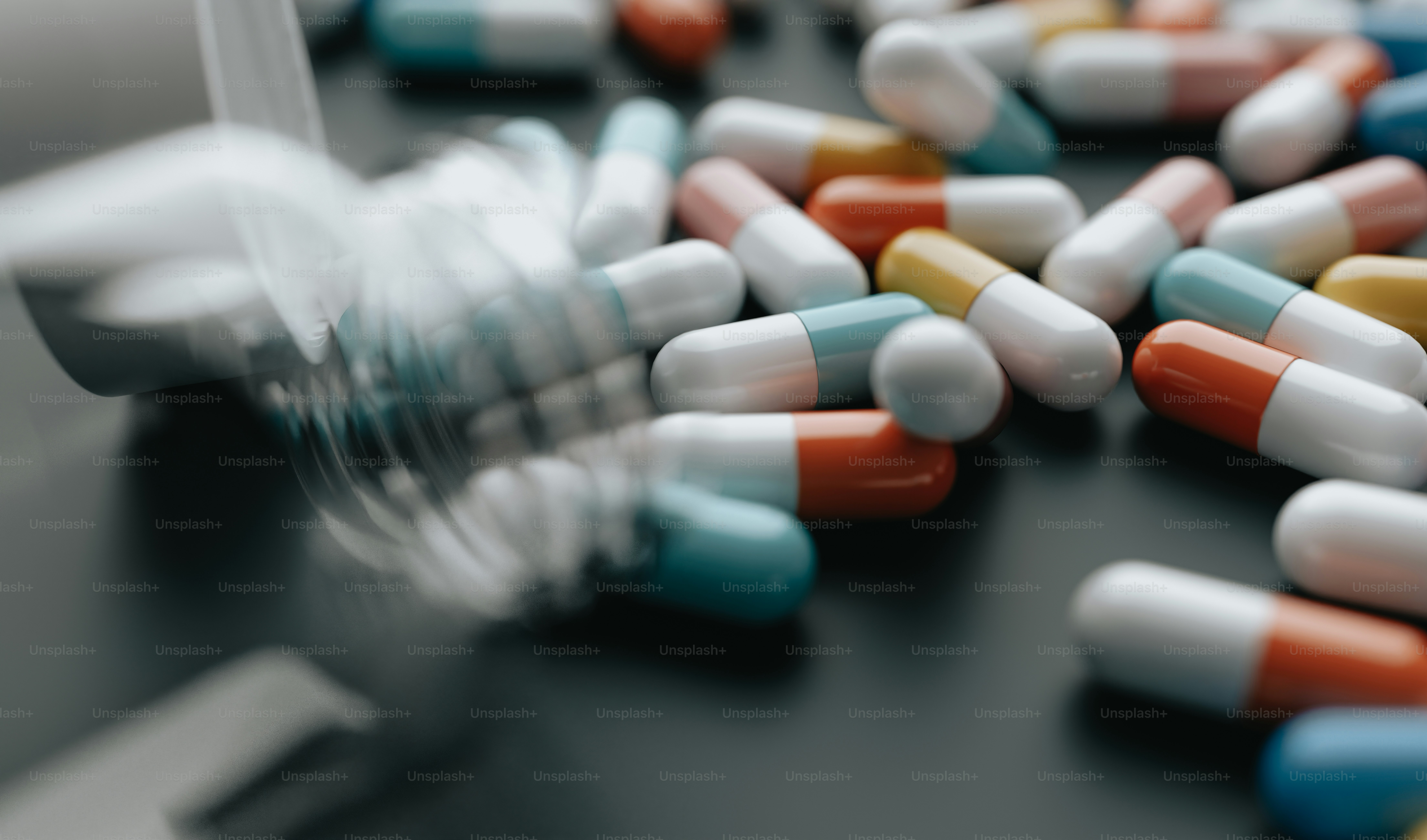 A close up of a bunch of pills on a table photo – Drugs Image on Unsplash