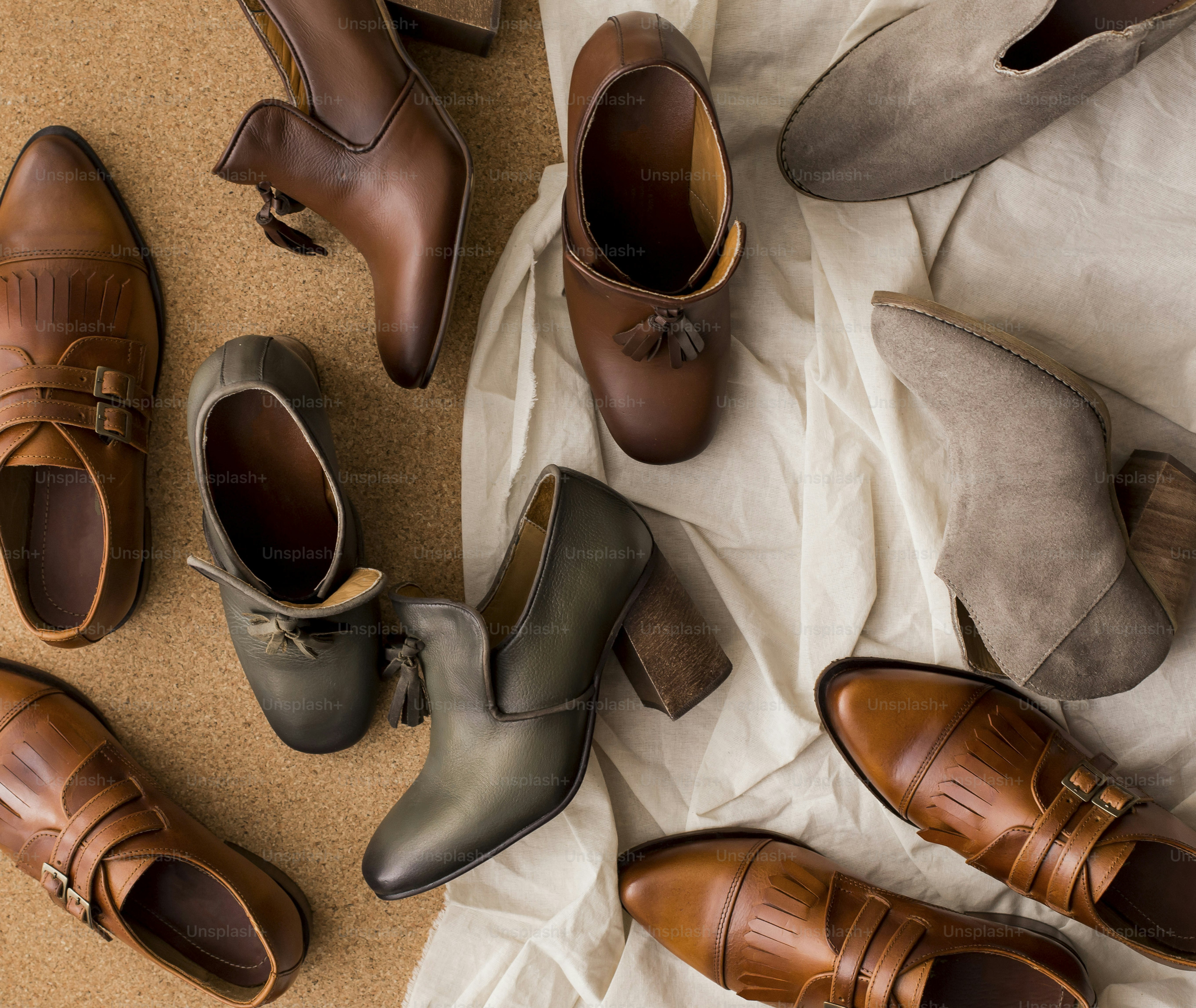 A bunch of shoes that are on a table photo – Fashion shoes Image on ...