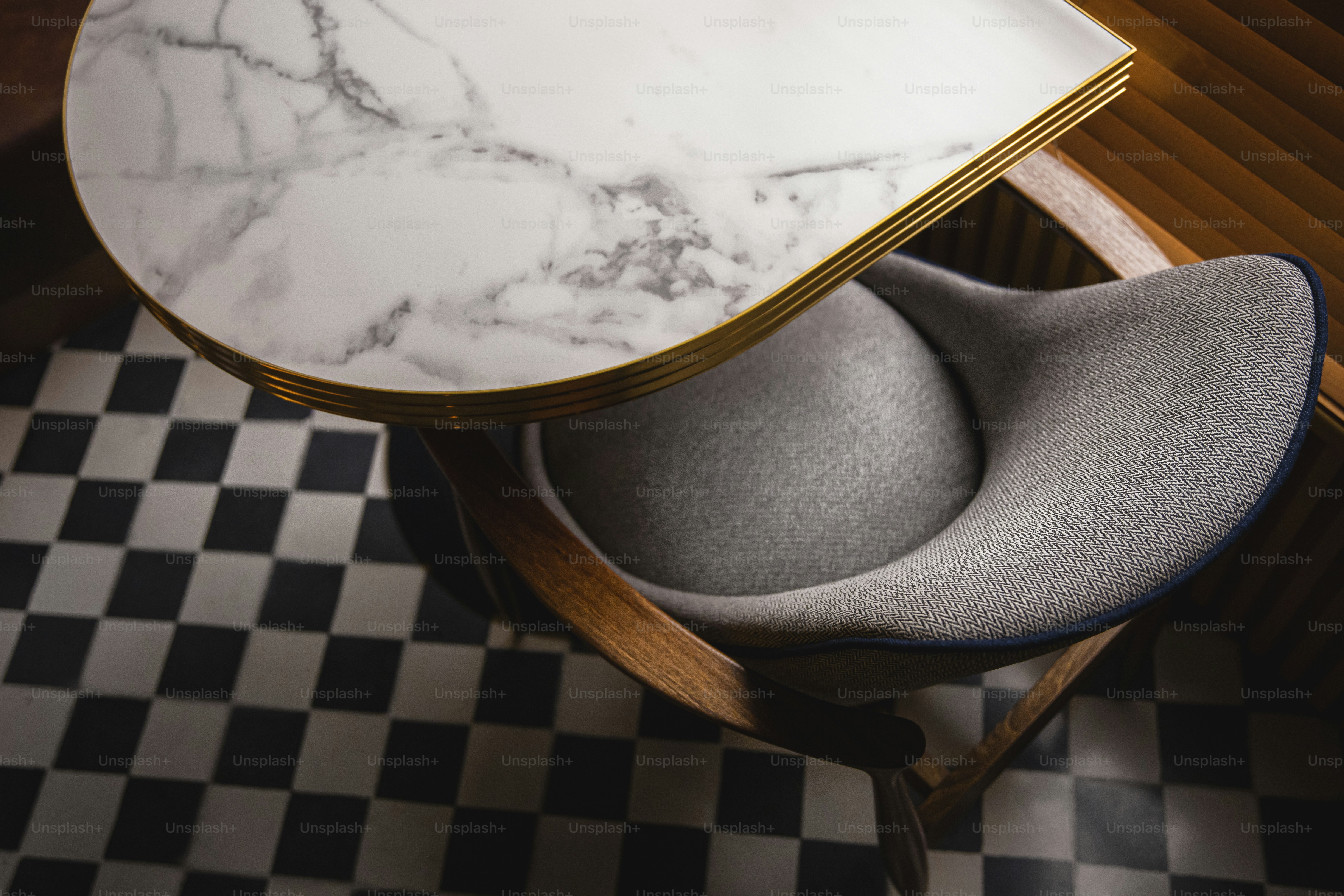 A restaurant with a long table and blue chairs photo – Interior Image ...