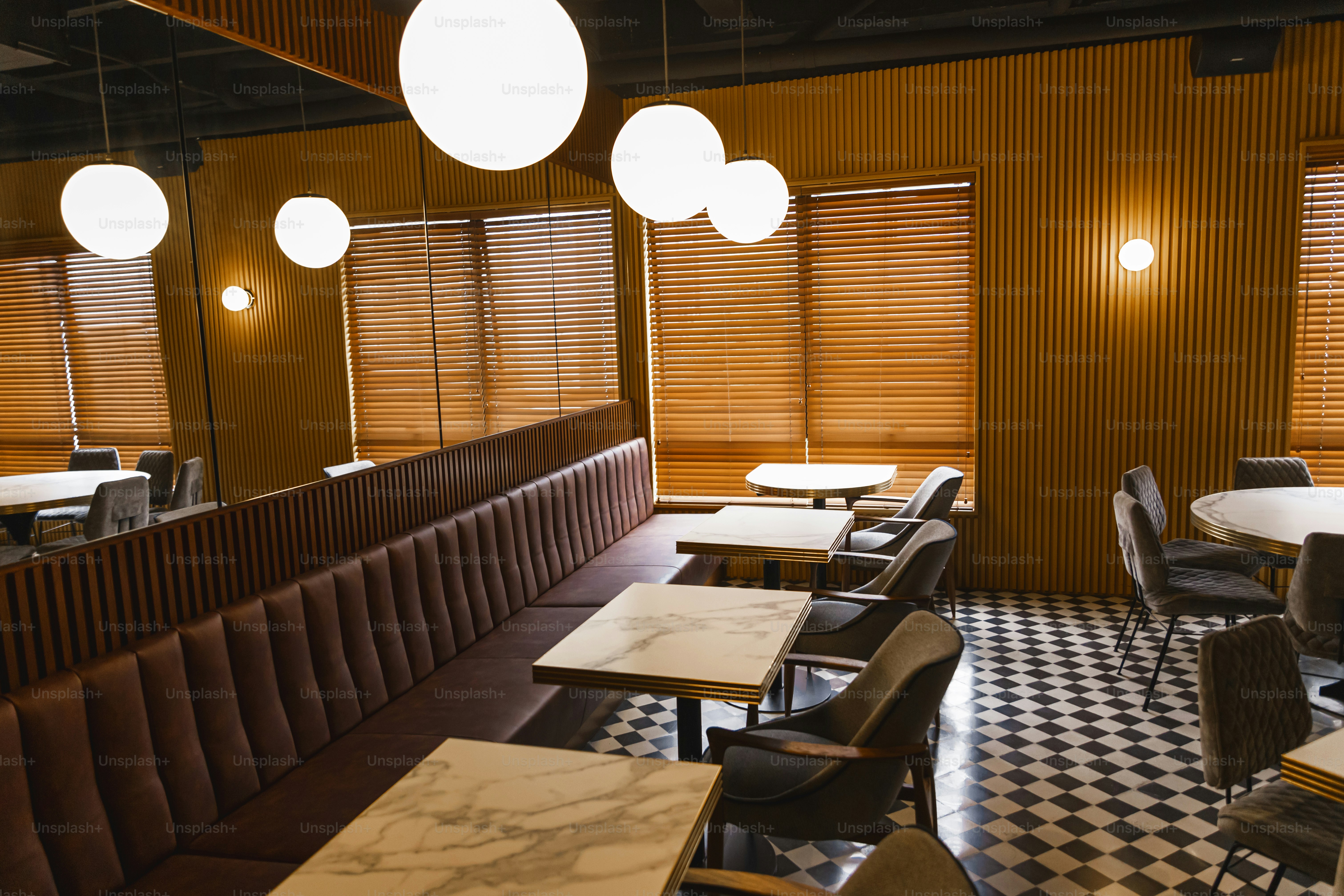 A restaurant with a checkered floor and wooden walls photo – Restaurant ...