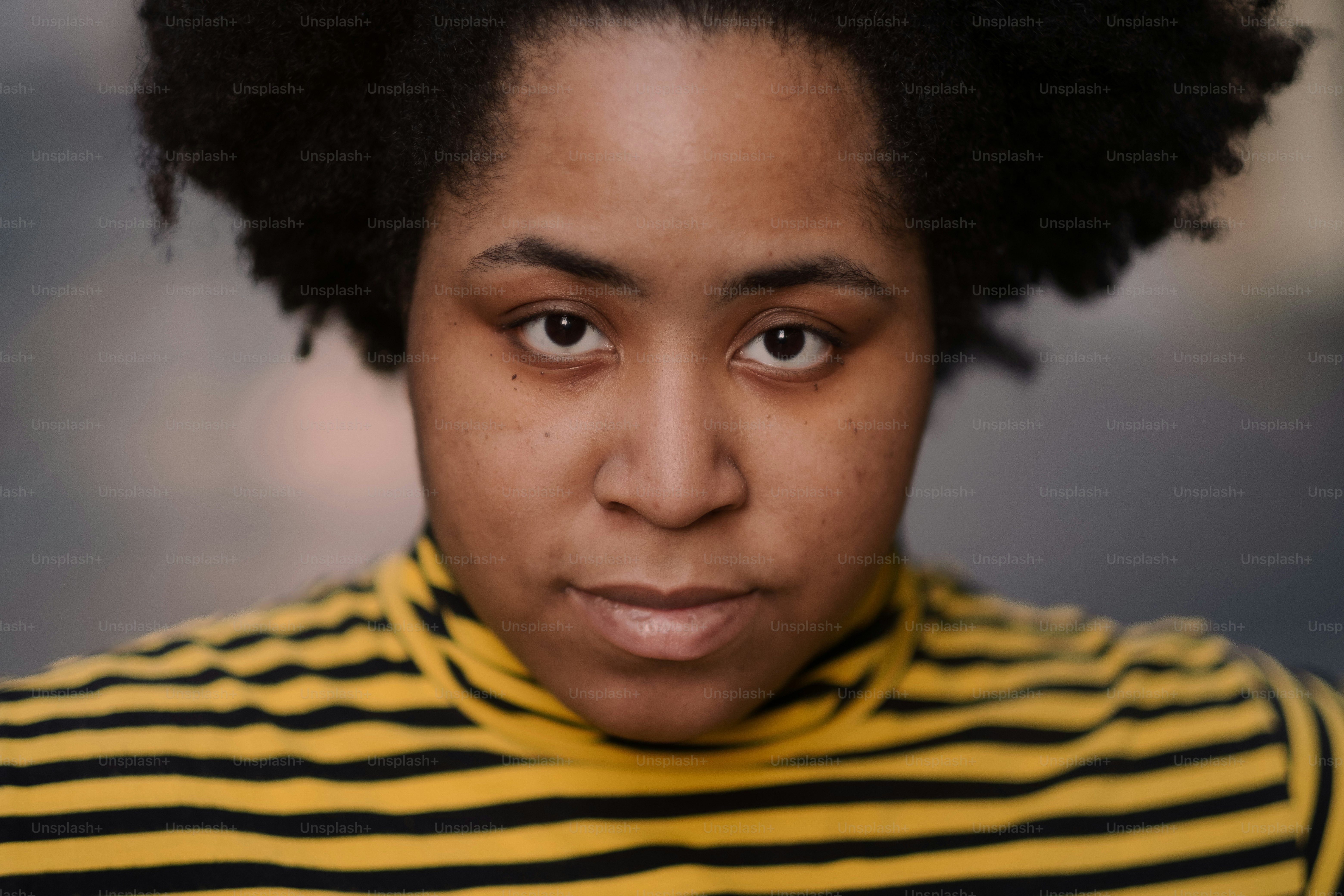A close up of a person wearing a striped shirt photo – Los angeles ...