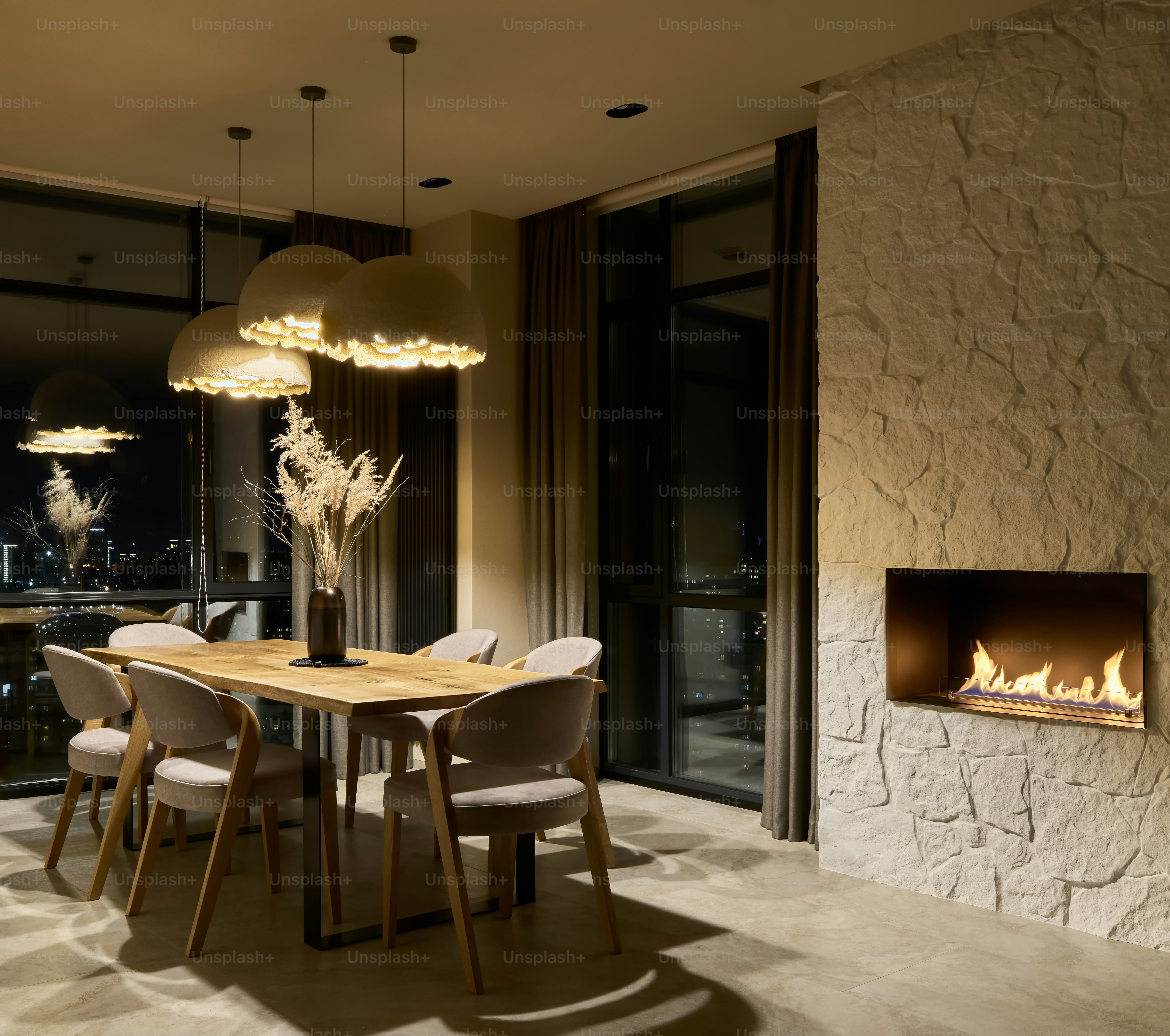 A dining room with a table and chairs and a fire place photo – Dining ...