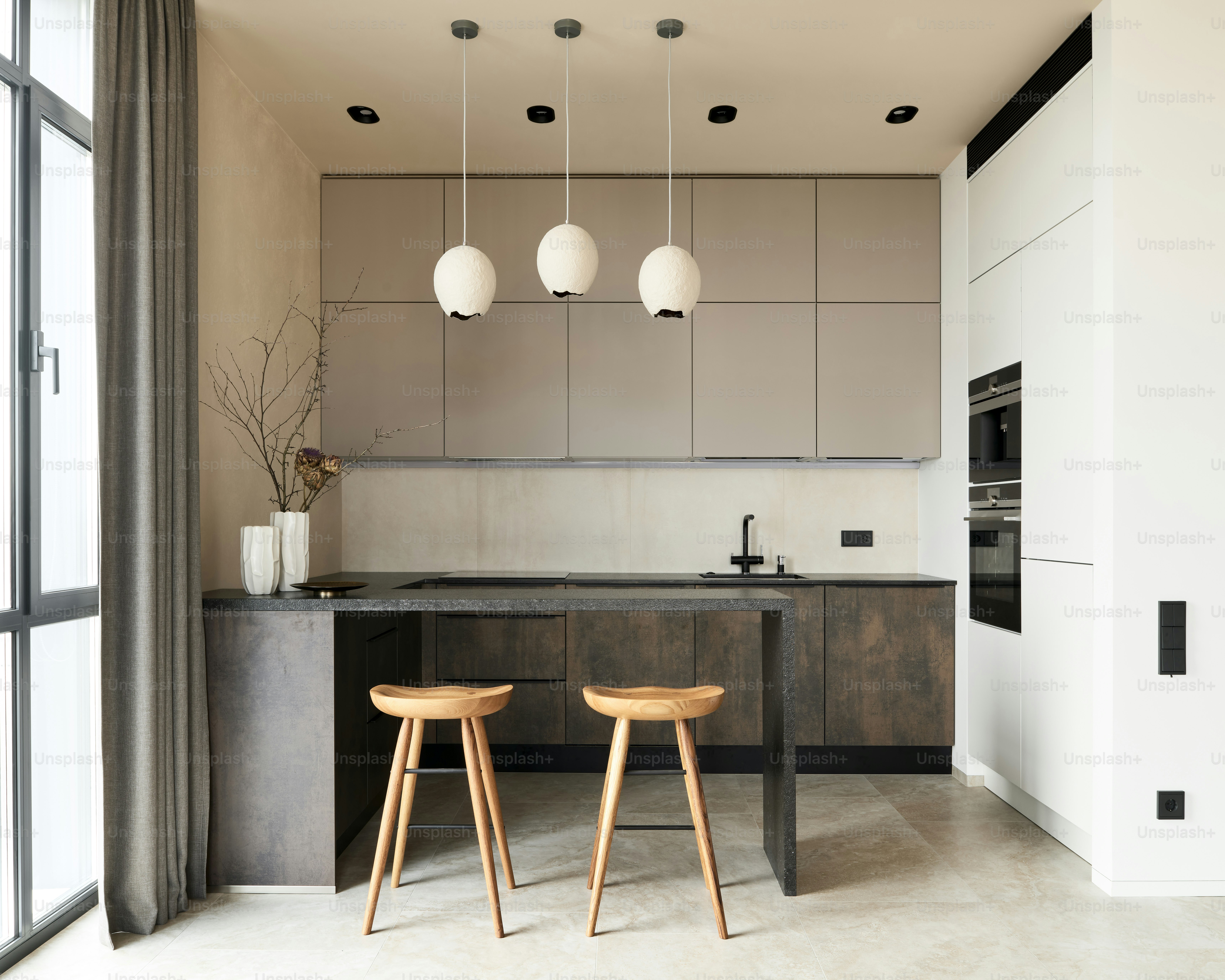 A kitchen with two stools next to a counter photo – Modern kitchen ...