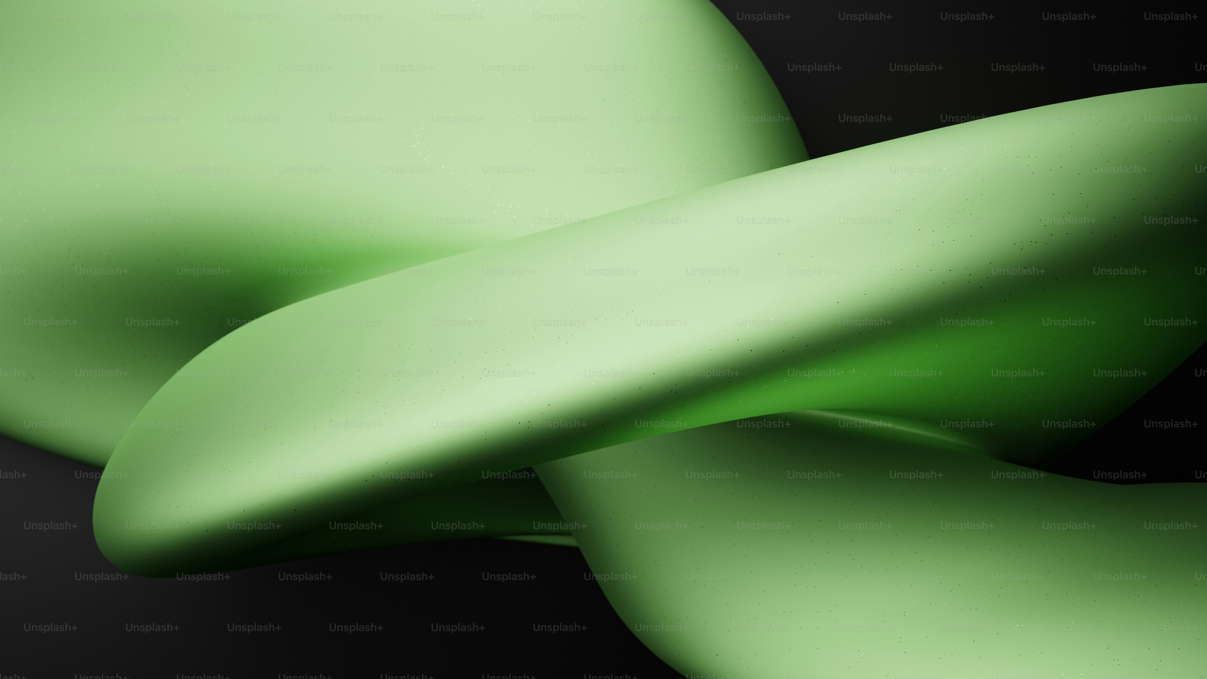 A close up of a green object on a black background photo – Wallpaper ...