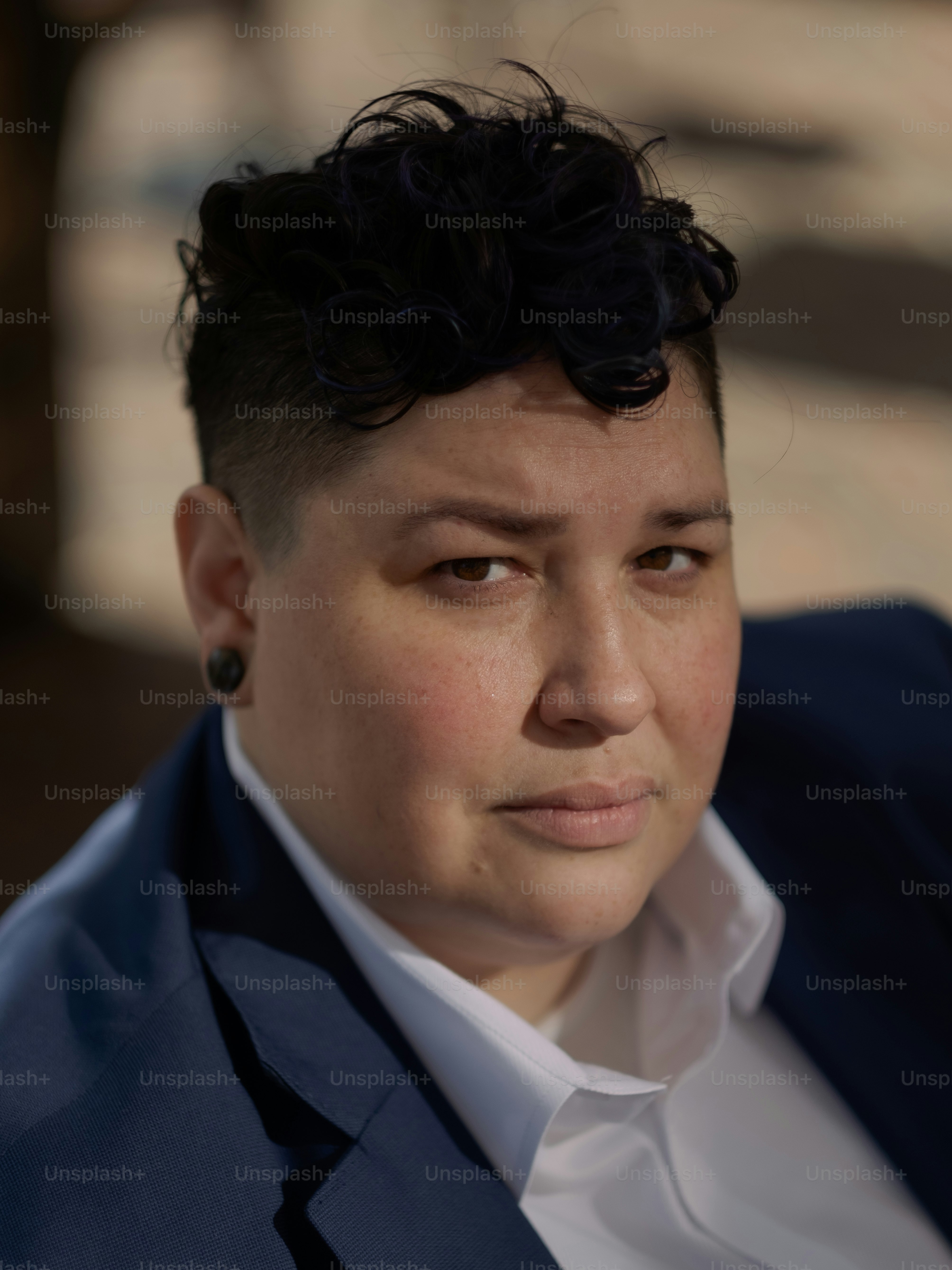 A close up of a person wearing a suit and tie photo – Lgbtq Image on ...