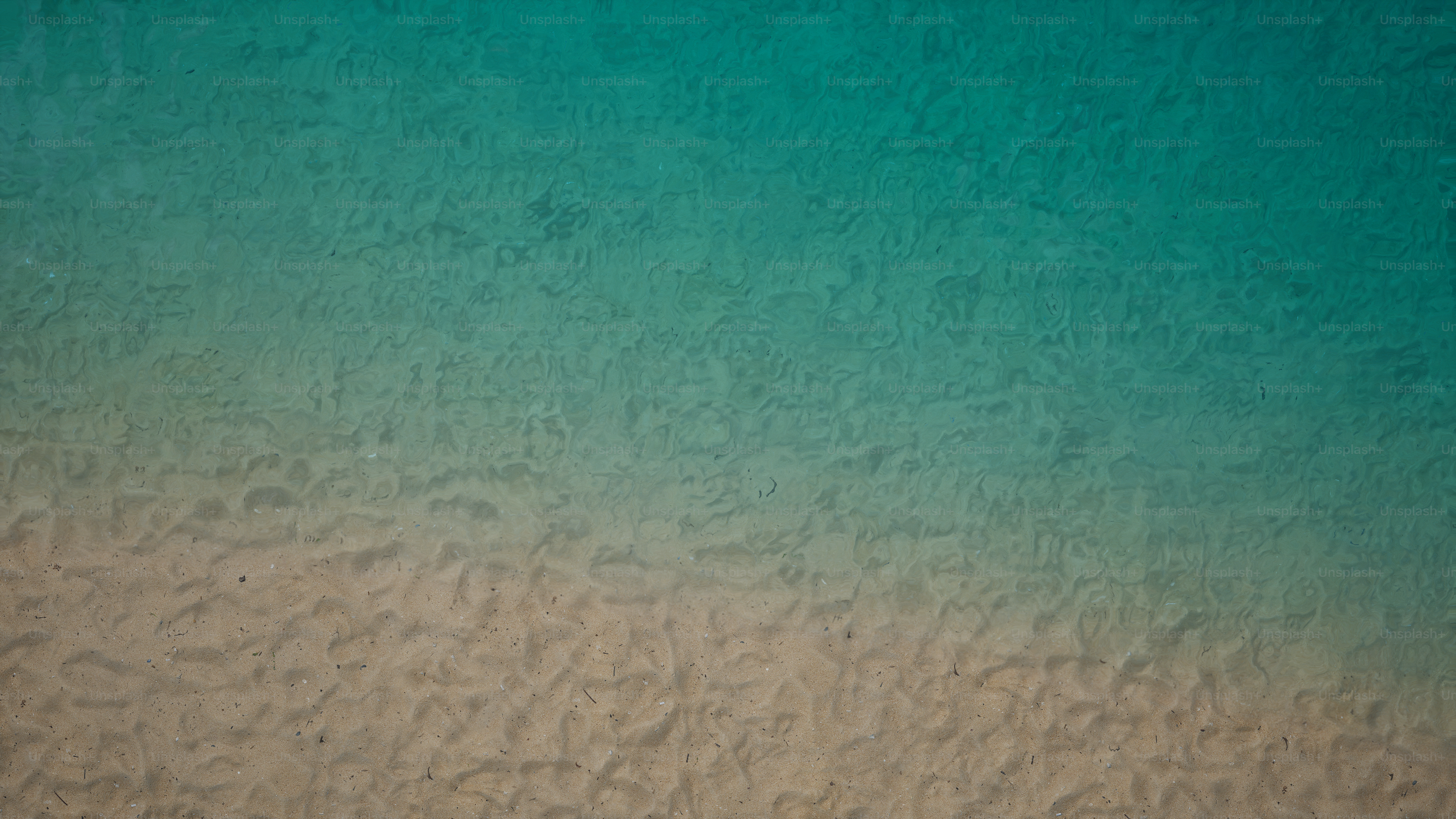 A beach scene with a surfboard on the sand photo – Deep water Image on ...