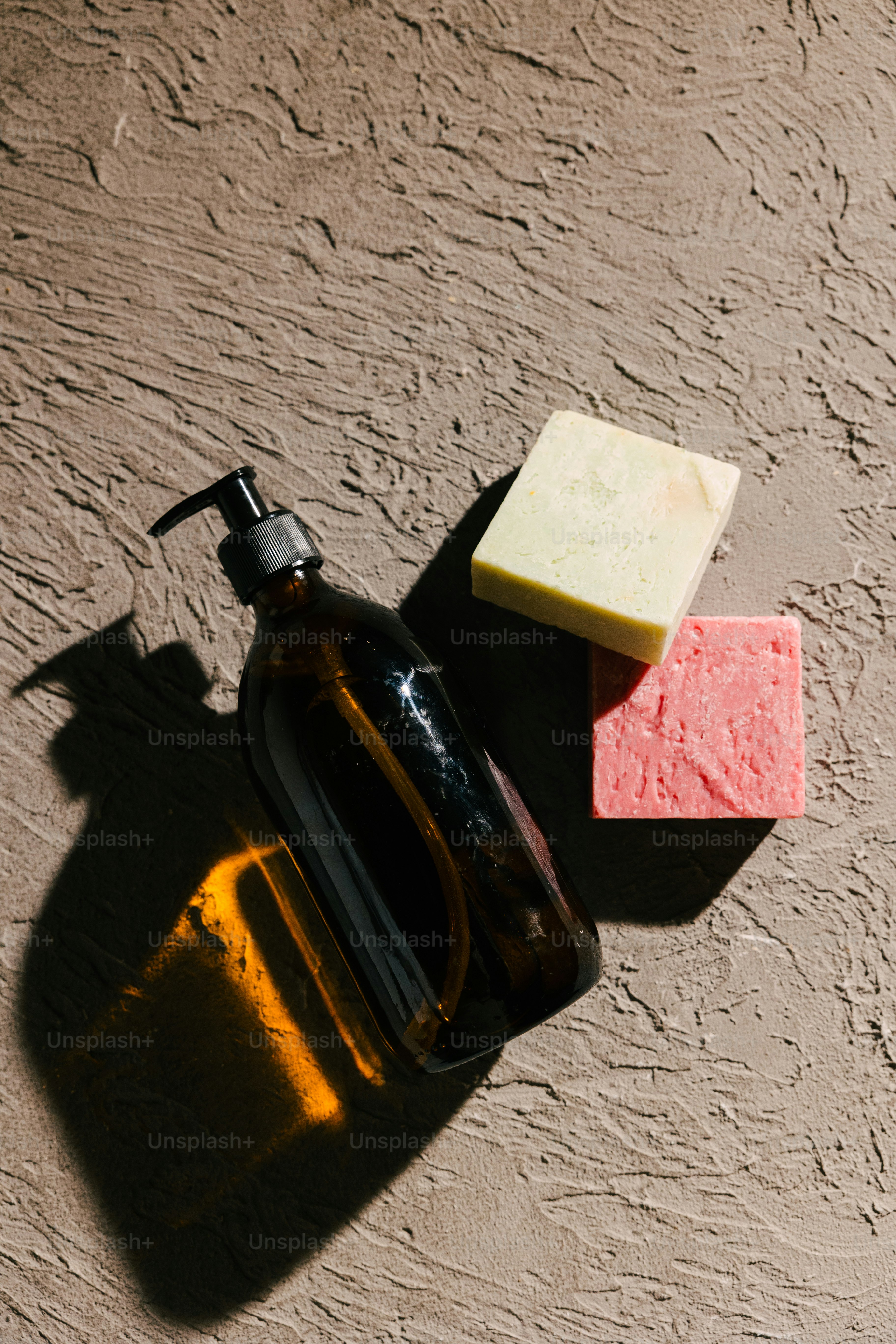 A bottle of soap next to a soap bar photo – Soap Image on Unsplash