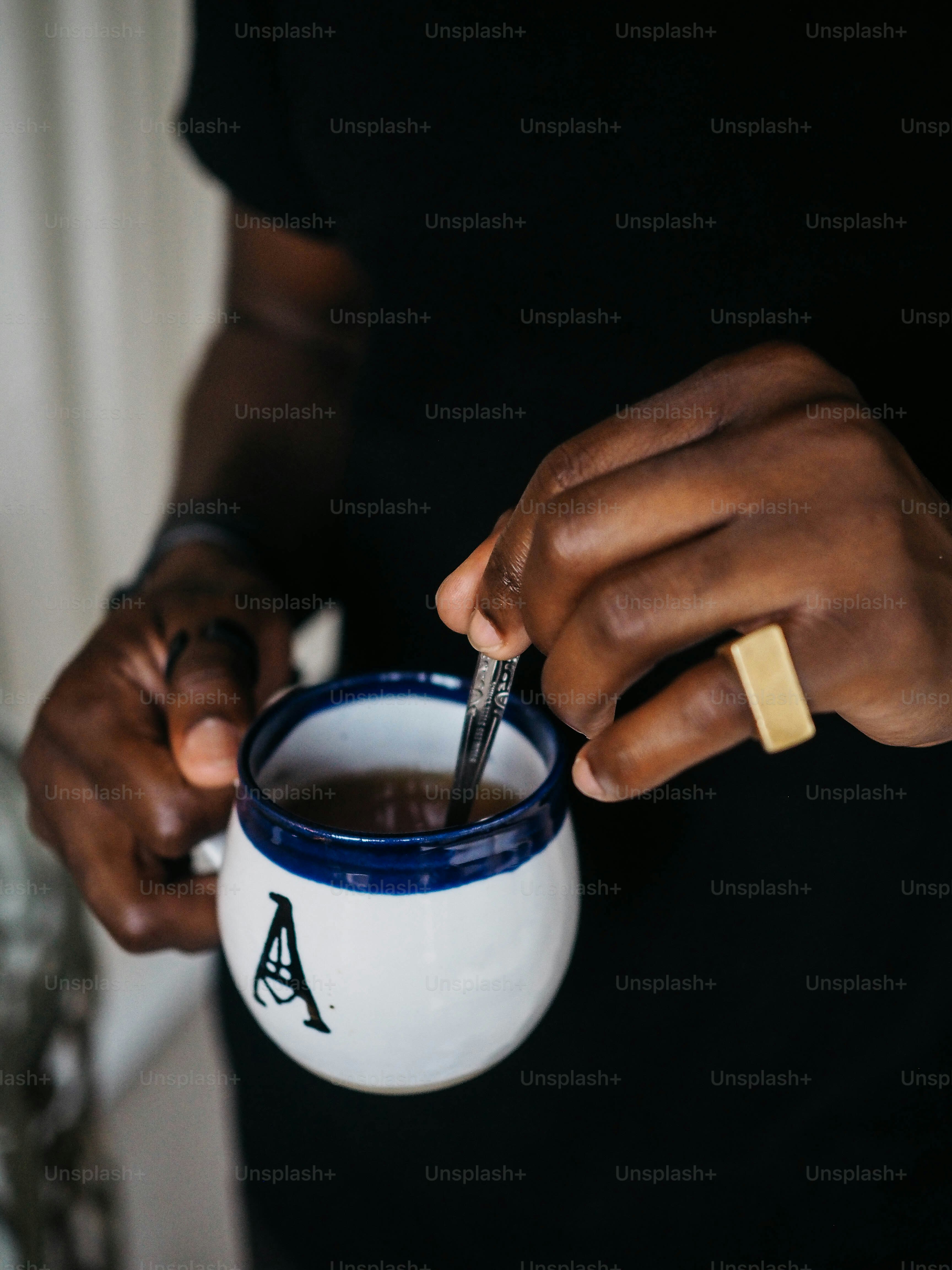 A hand reaching for an ice cream cone photo – Ice cream cup Image on ...