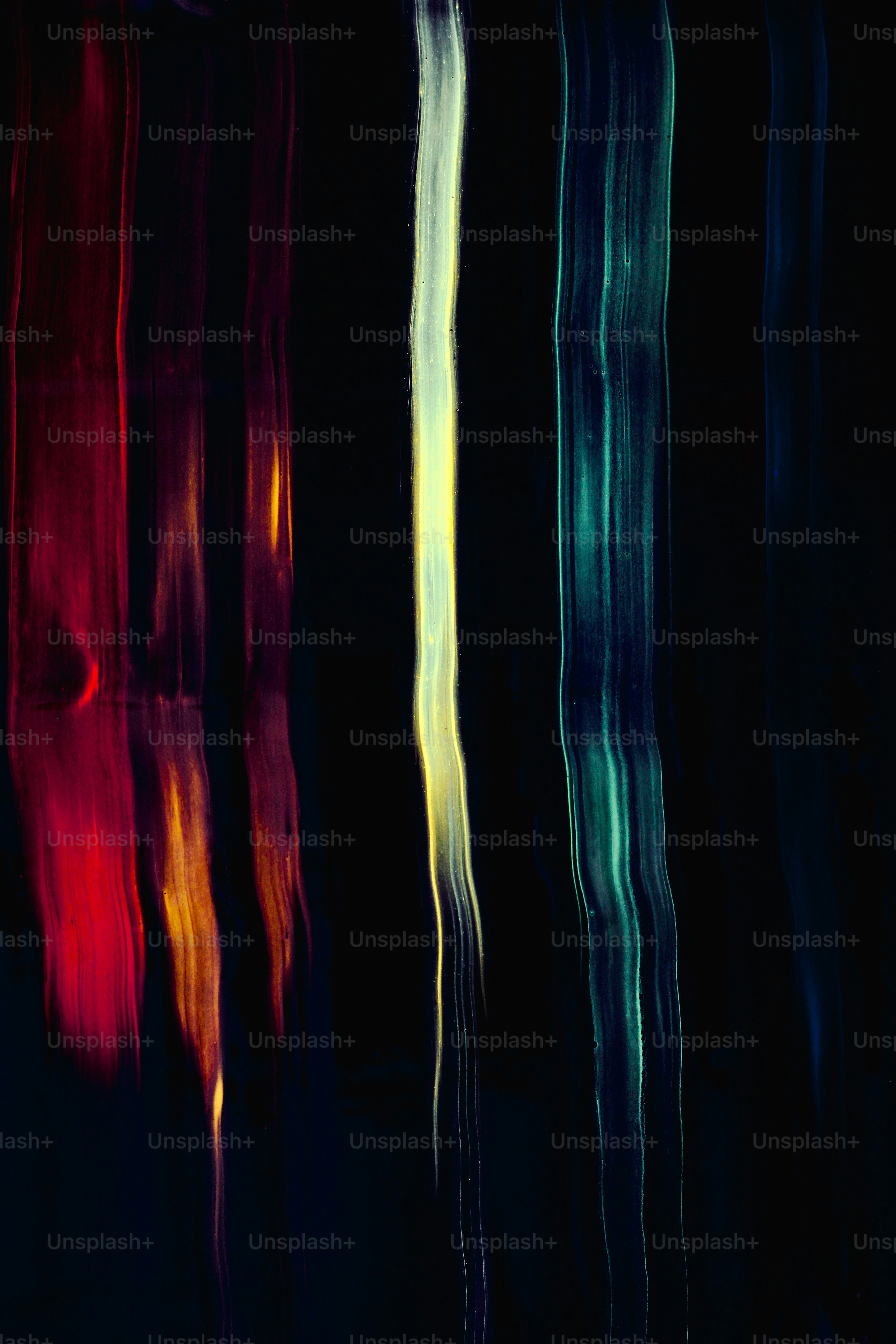 A group of multicolored ribbons hanging from a ceiling photo ...