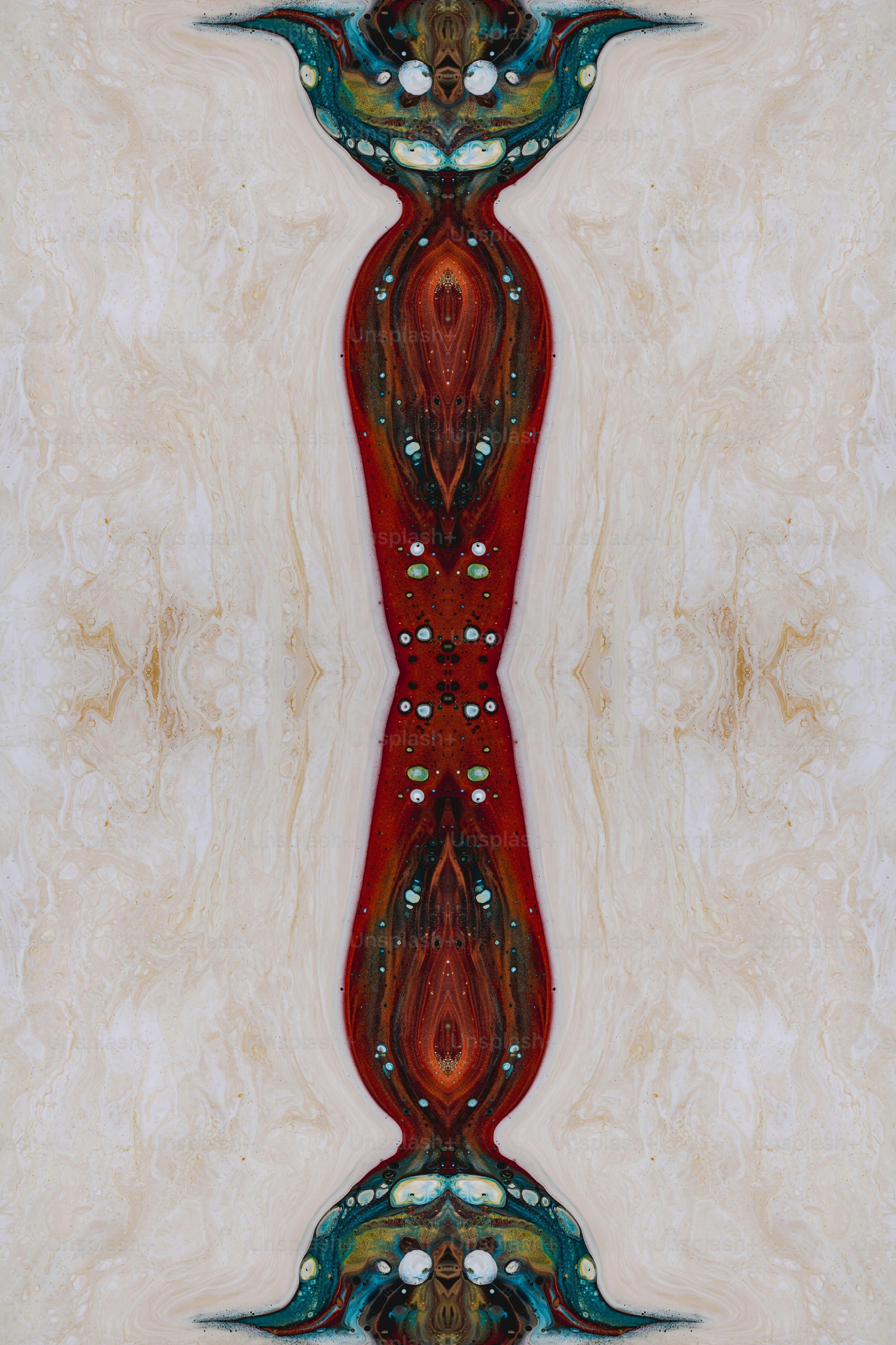 A painting of a red and green design on a white background photo ...