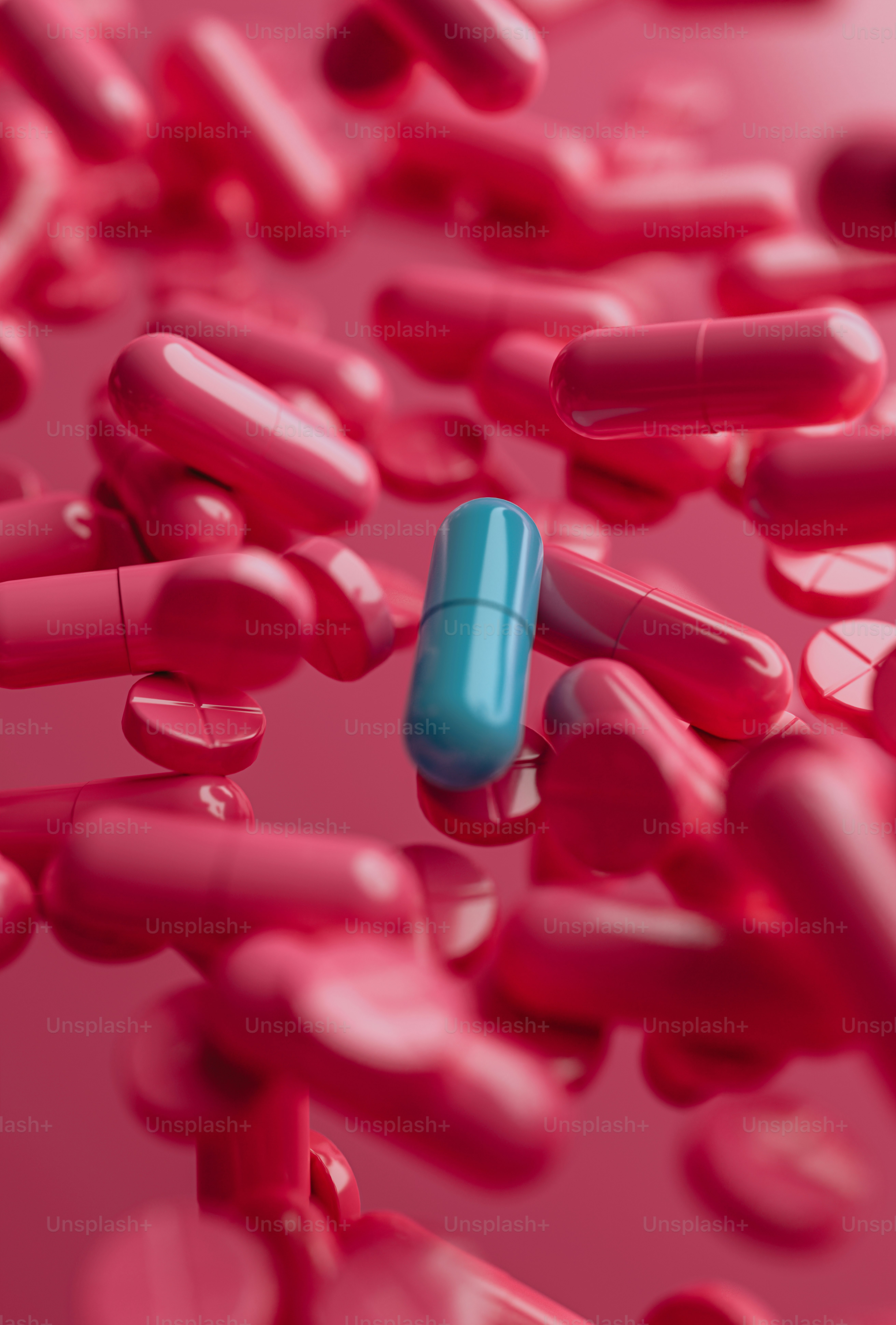 A blue pill pill surrounded by pink pills photo – Pink blue Image on ...