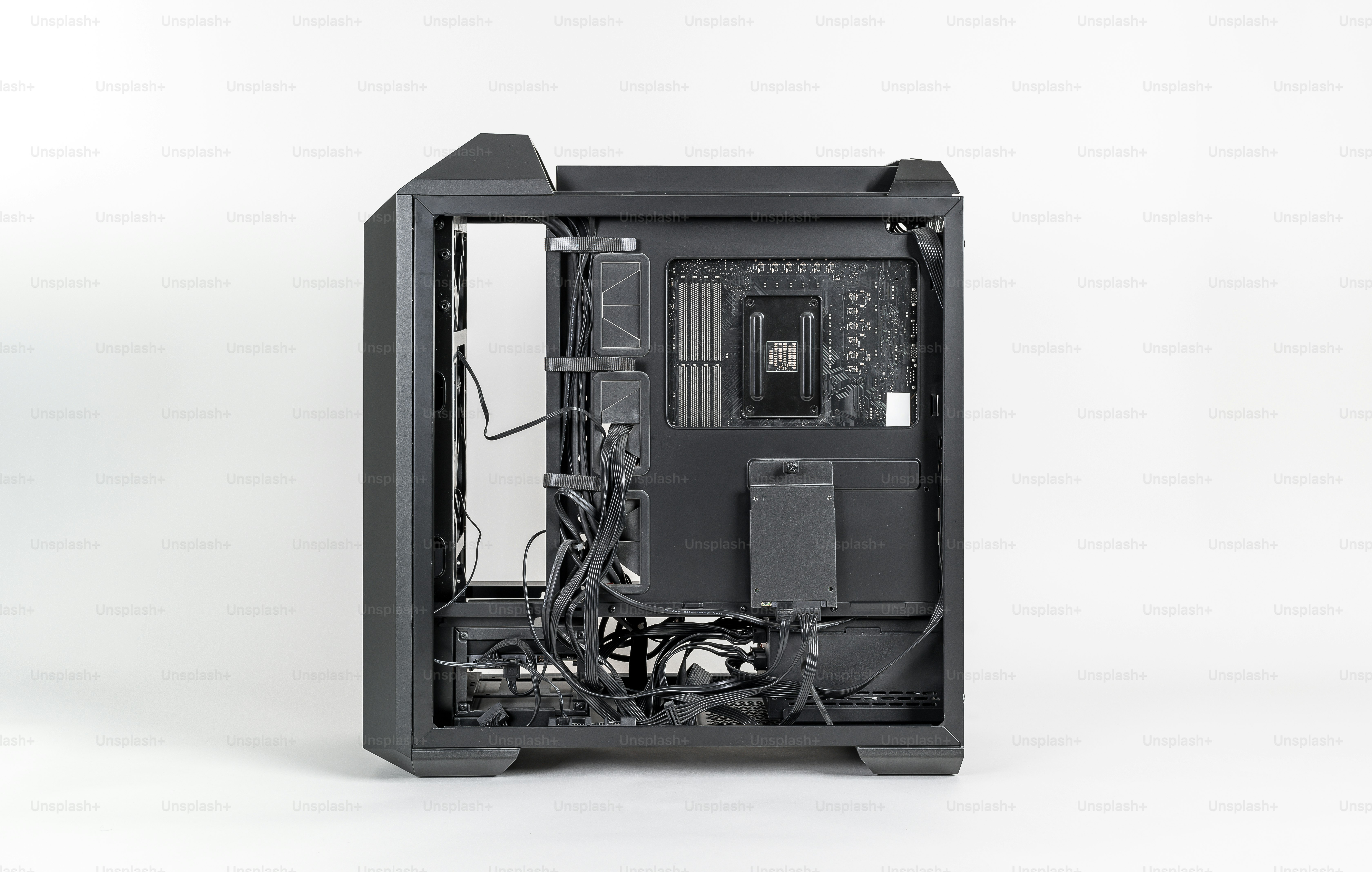 A black and yellow computer case on a white background photo ...