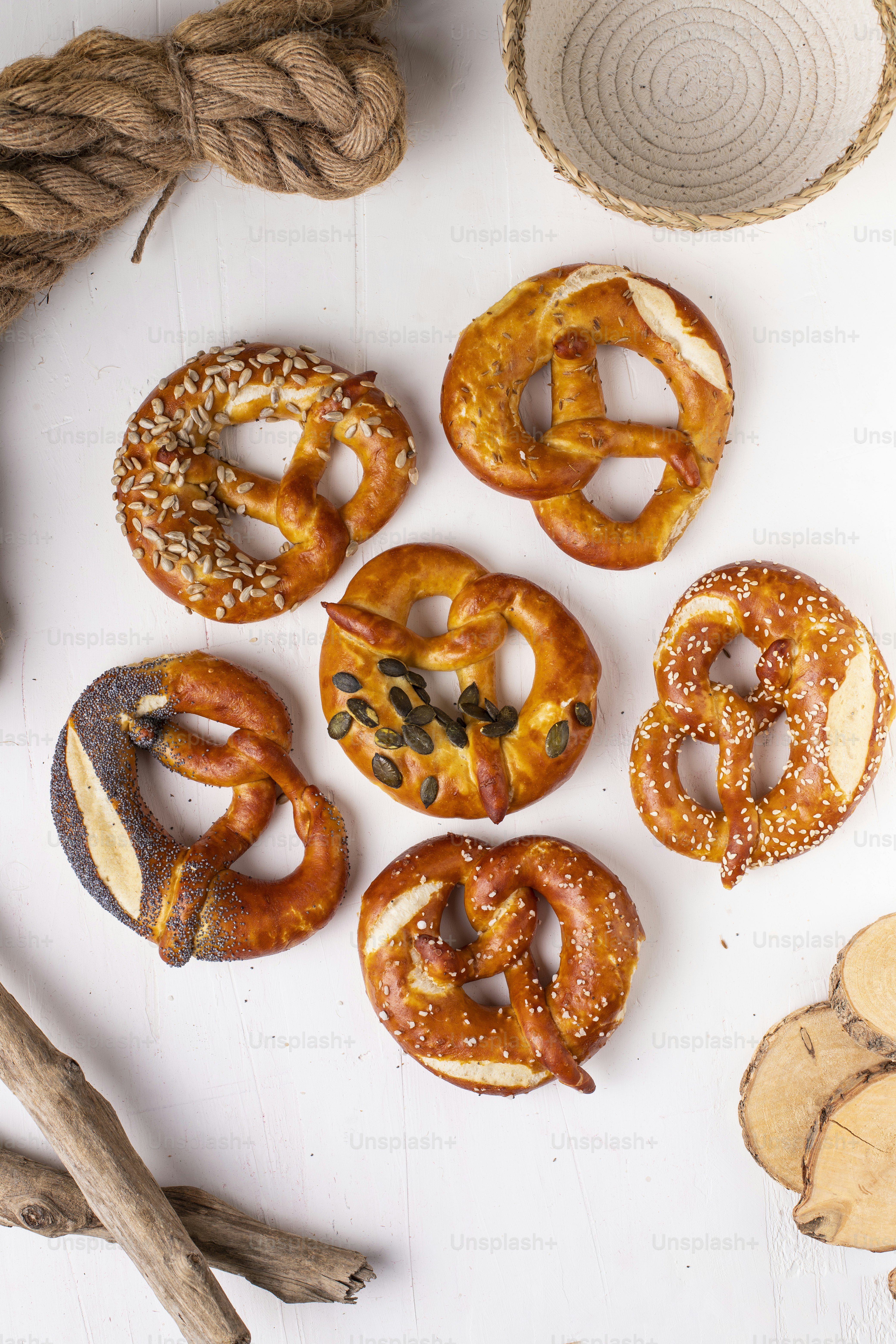 A group of pretzels sitting on top of a white table photo – Pretzel ...
