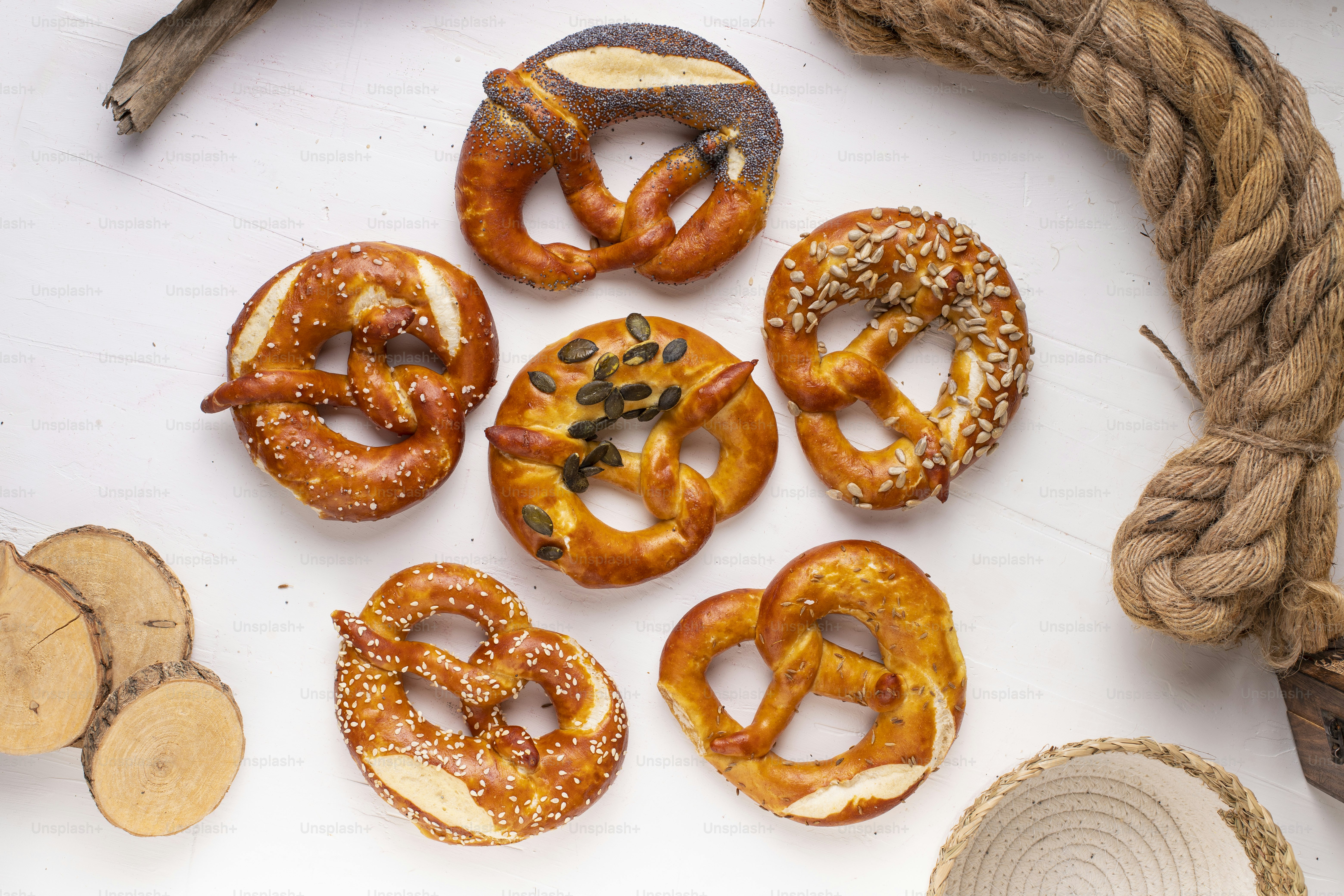 A group of pretzels sitting on top of a white table photo – German ...