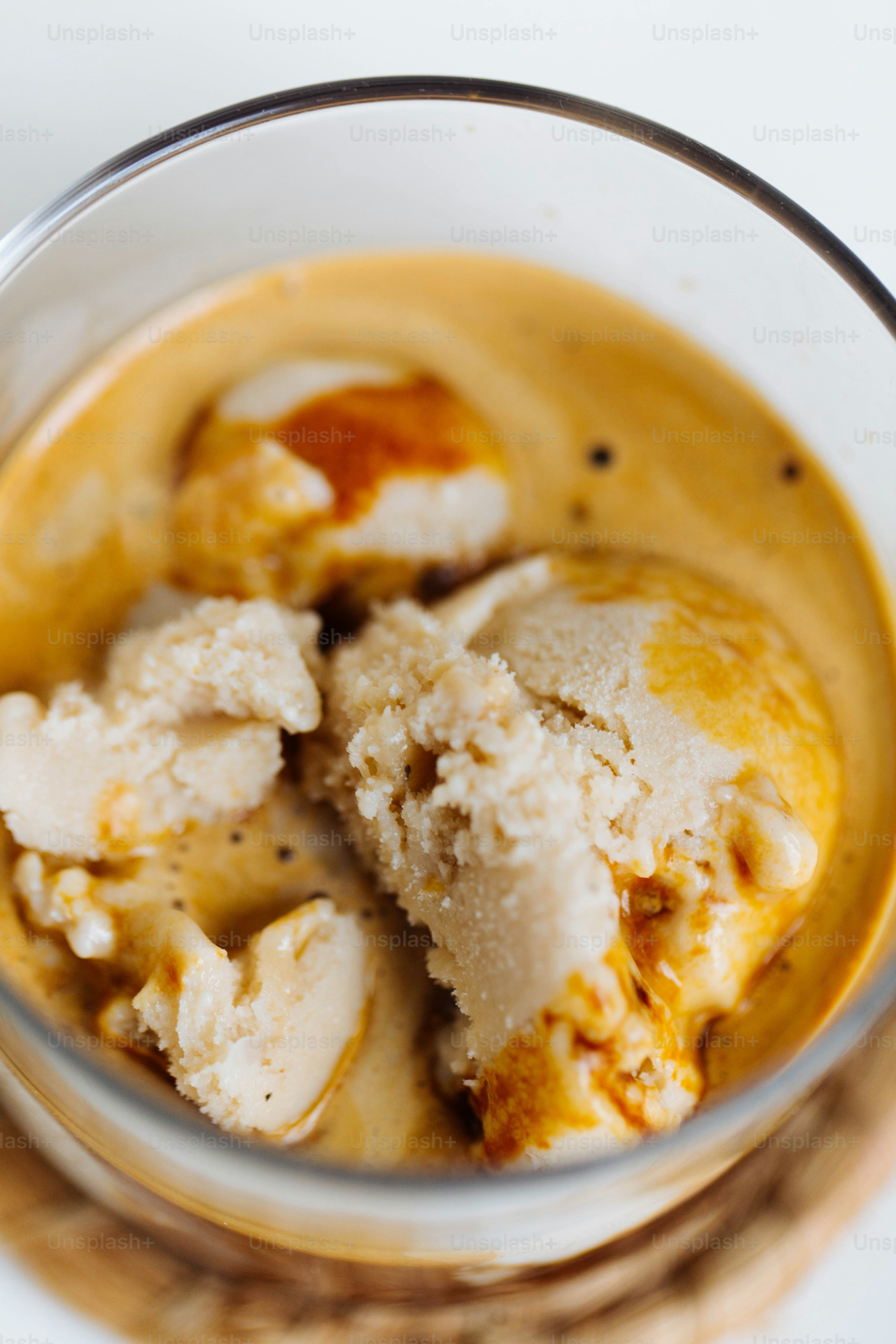 A bowl filled with ice cream on top of a table photo – Ice cream Image ...