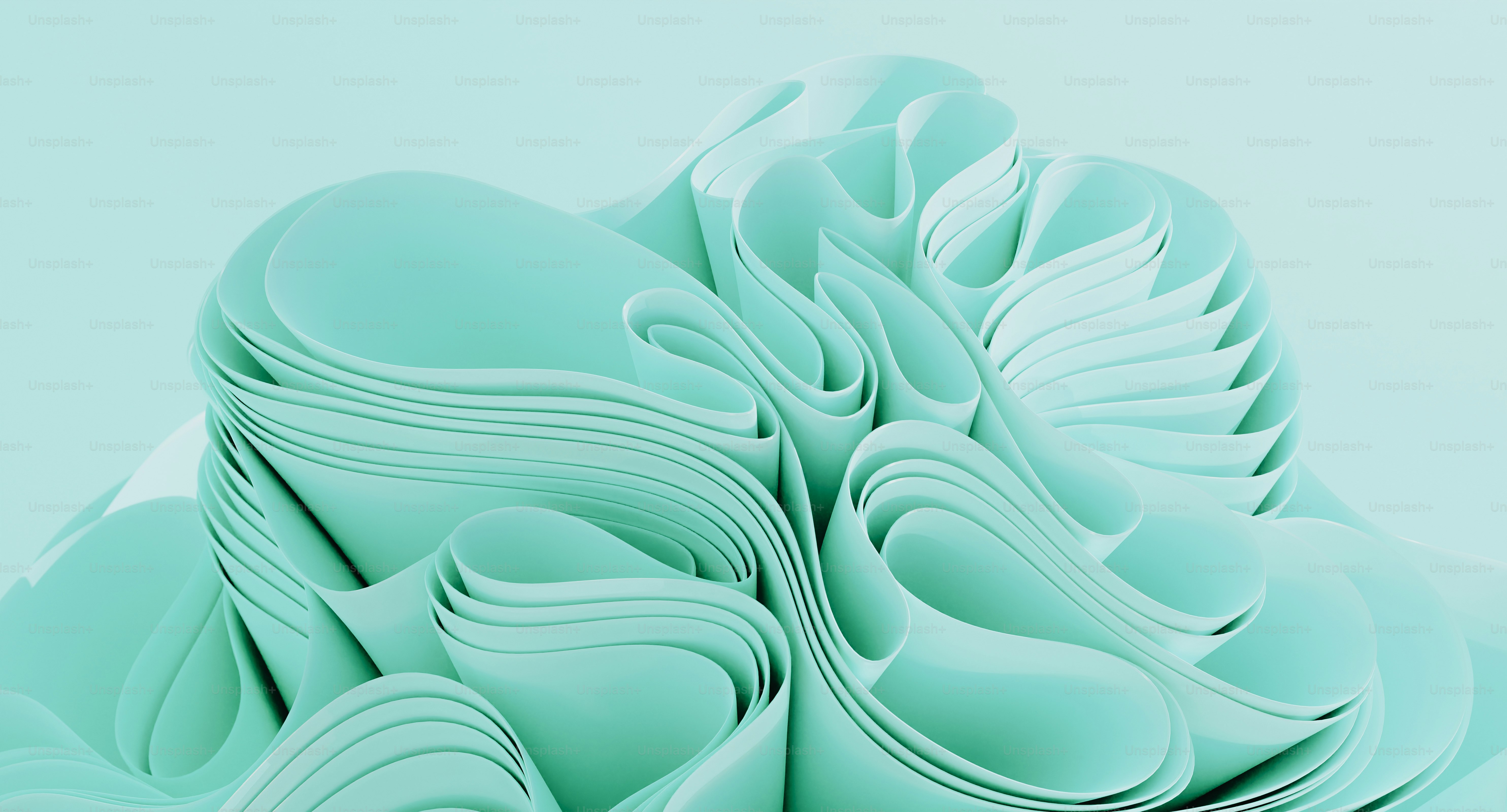 A large stack of folded papers sitting on top of a table photo – 3d art ...