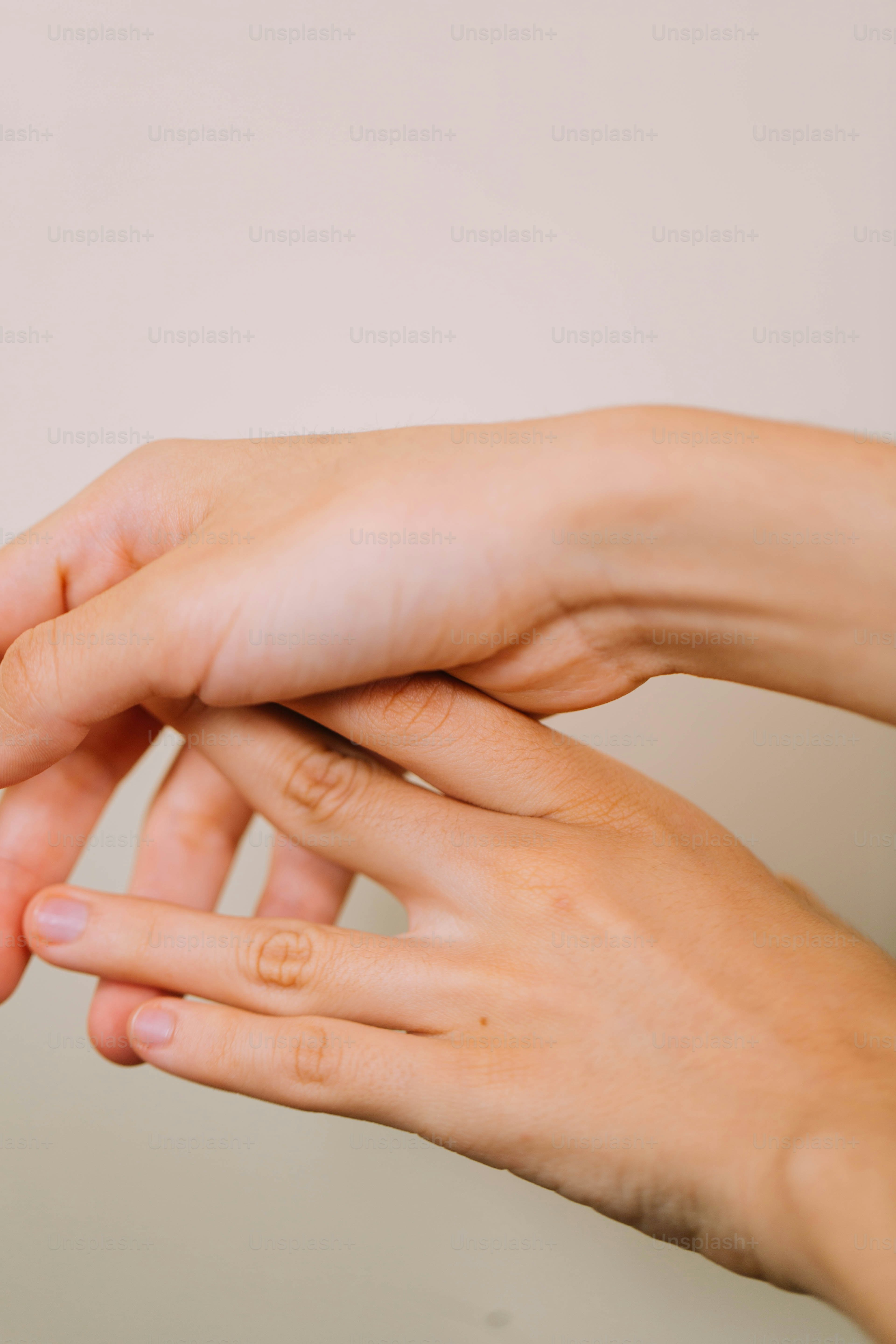 A couple of people holding each other's hands photo – Multicultural ...