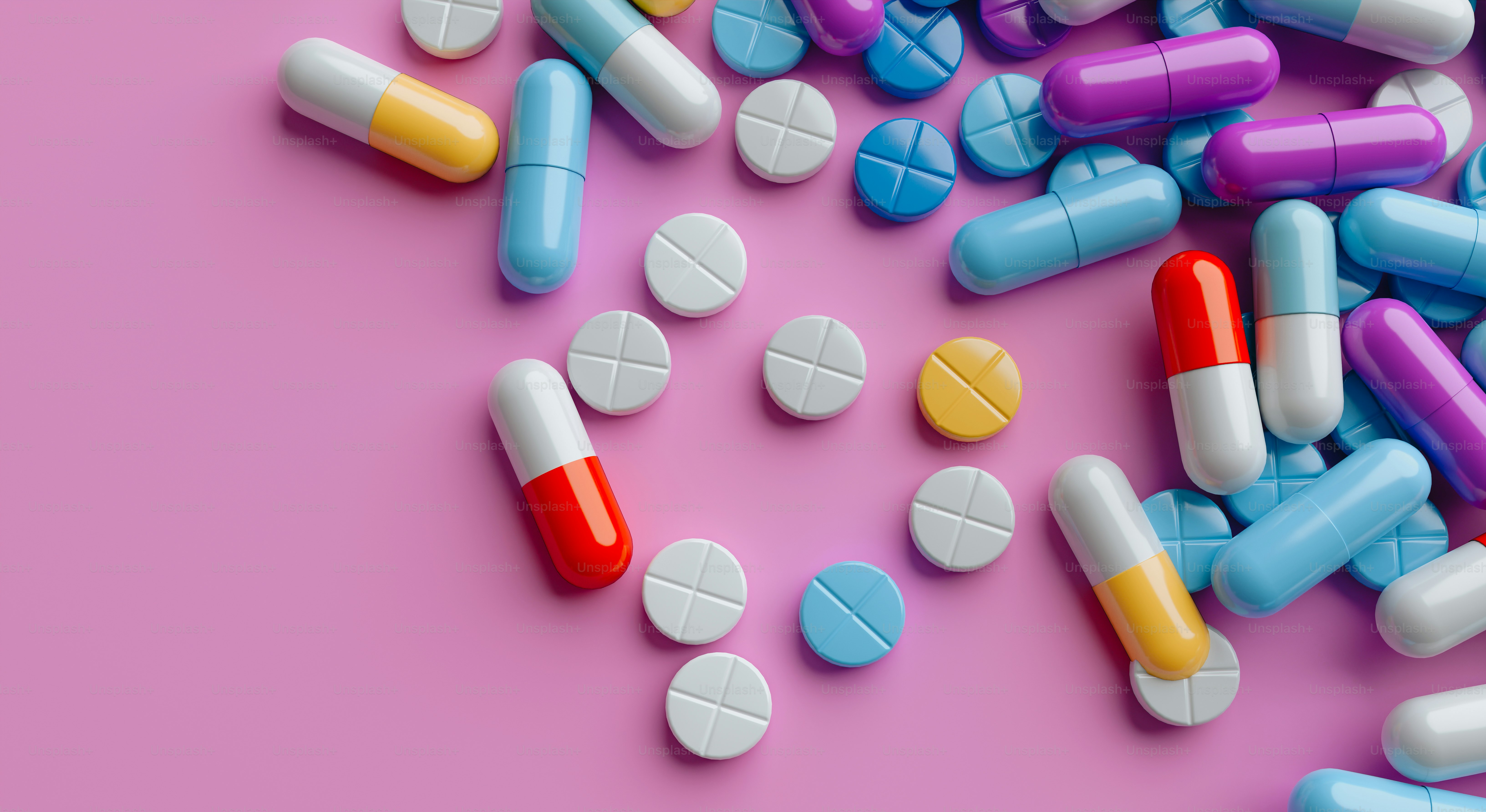 A group of pills sitting on top of each other photo – Wallpaper Image ...