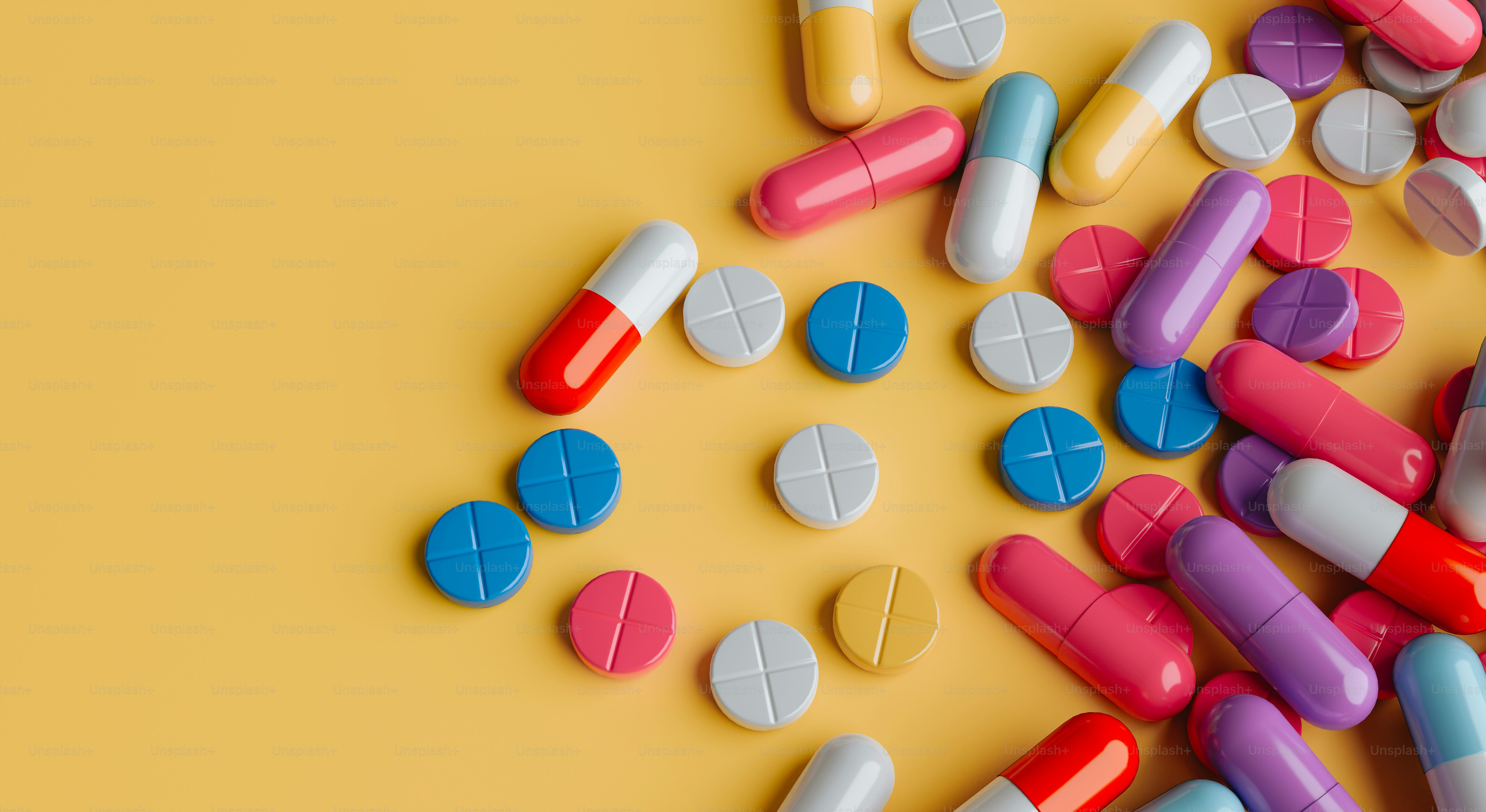 A pile of colorful pills on a yellow background photo – Capsules Image ...