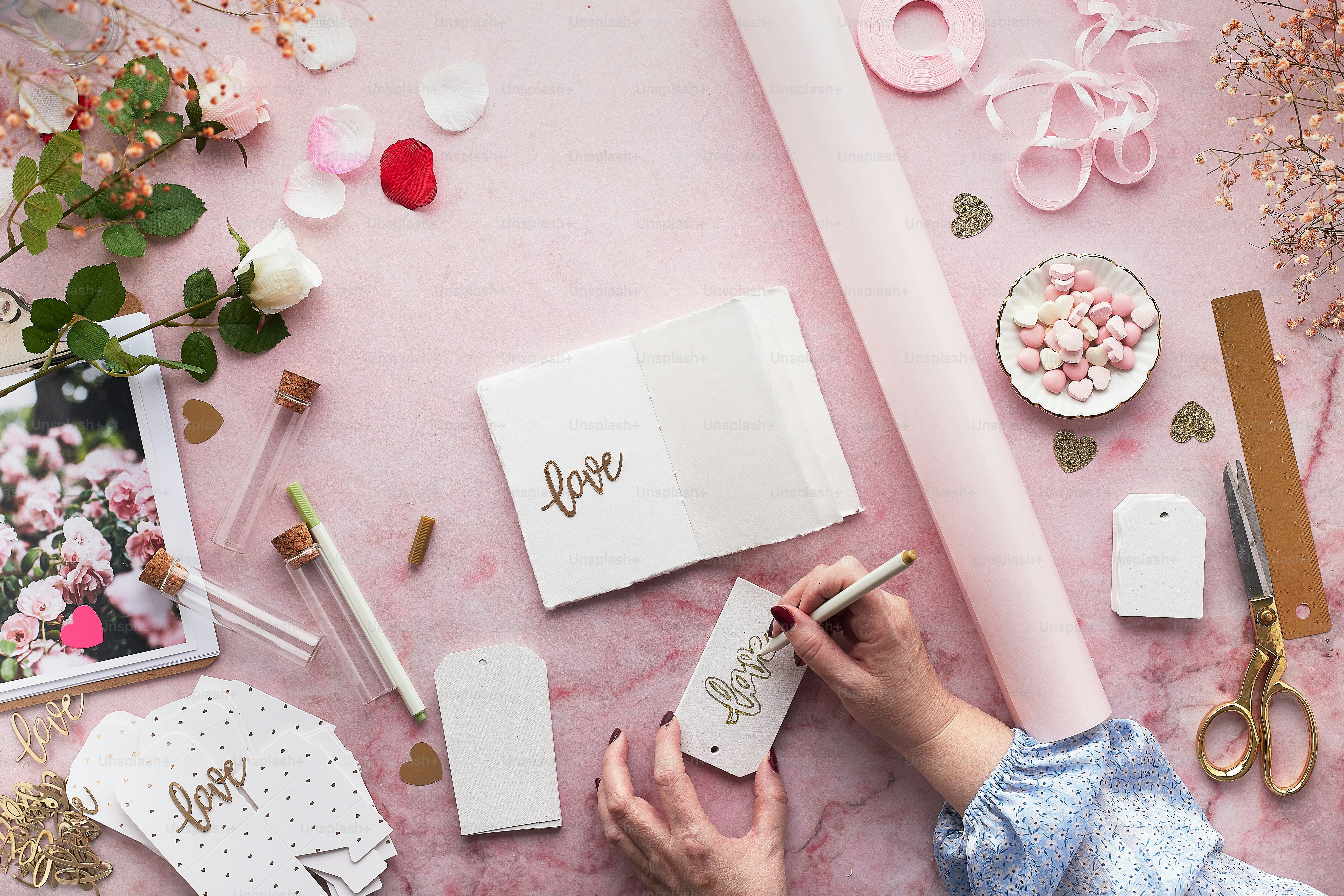 A person writing on a piece of paper photo – Saint valentin Image on ...