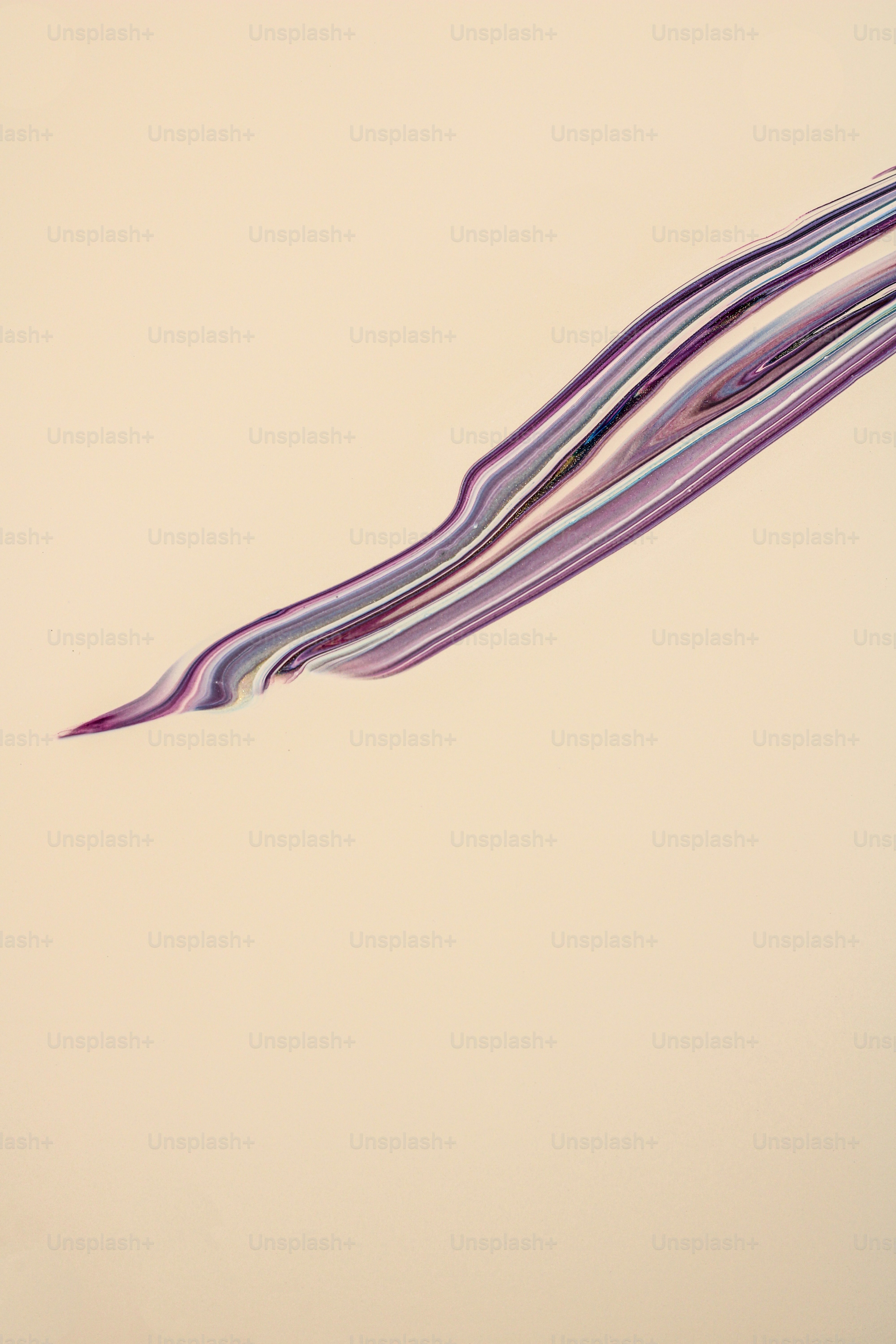 A purple and blue striped object floating in the air photo – Texture ...