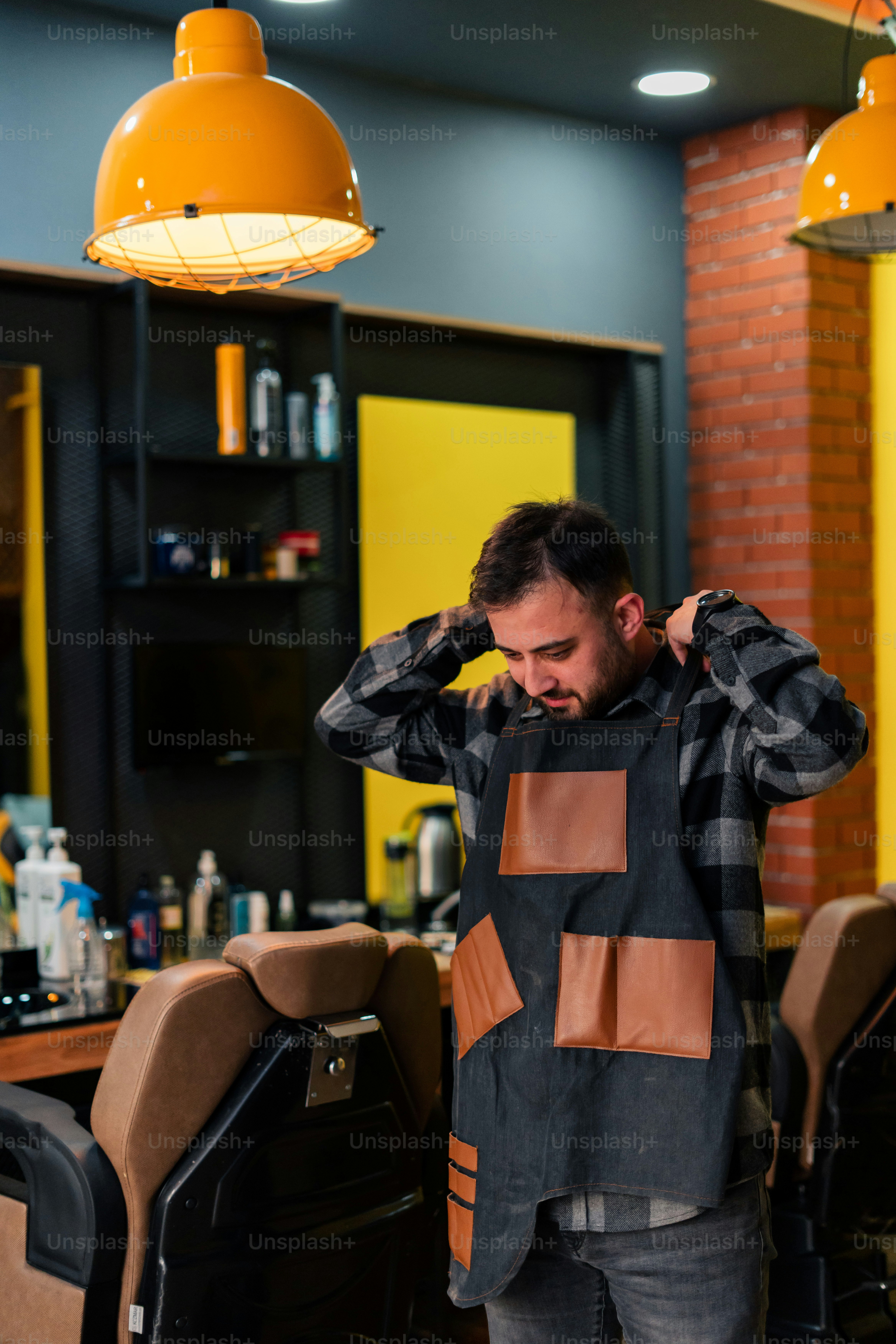 A man standing in front of a hair salon photo – Professional Image on ...