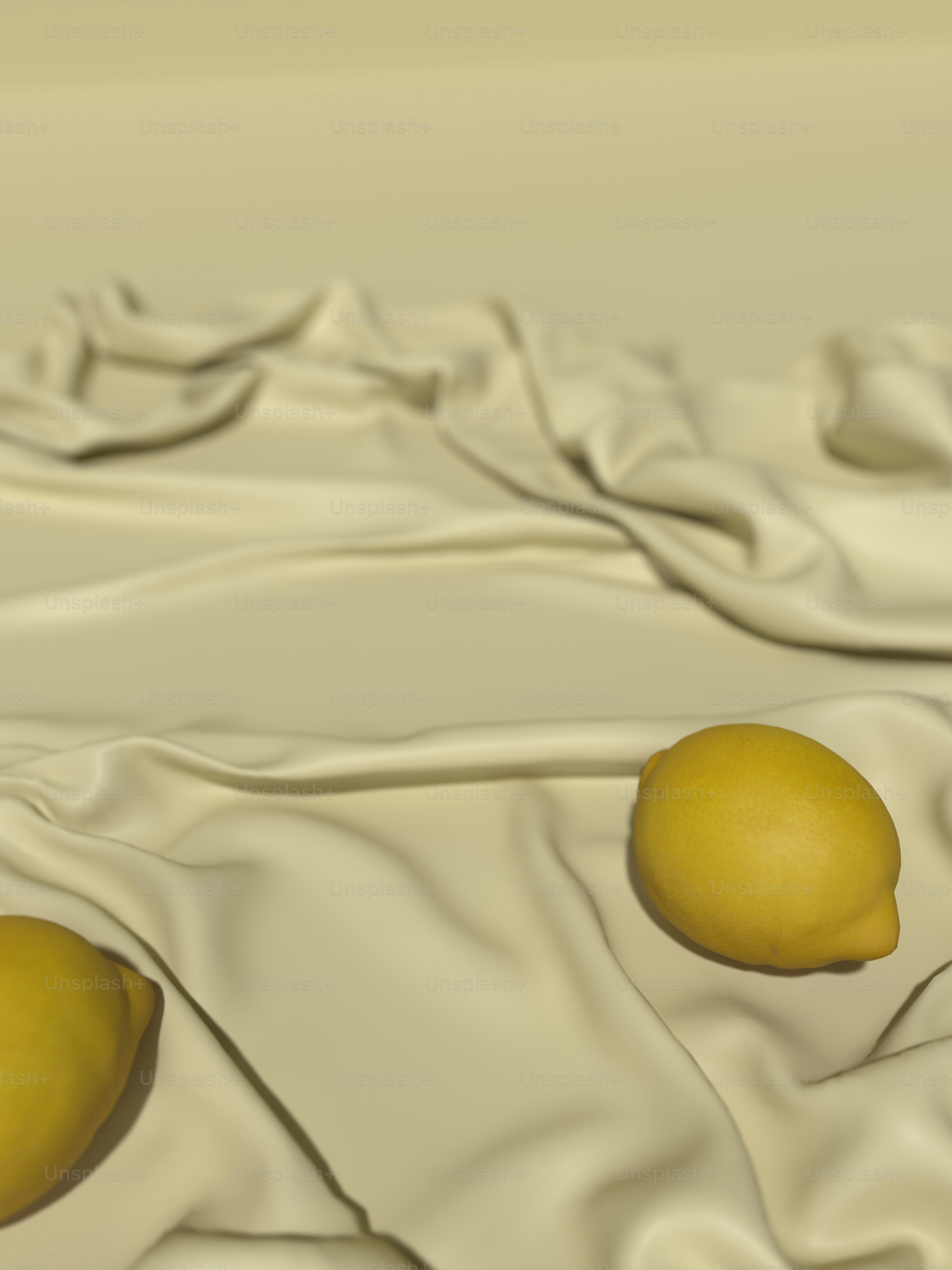 Two lemons sitting on a white cloth photo – Cloth Image on Unsplash