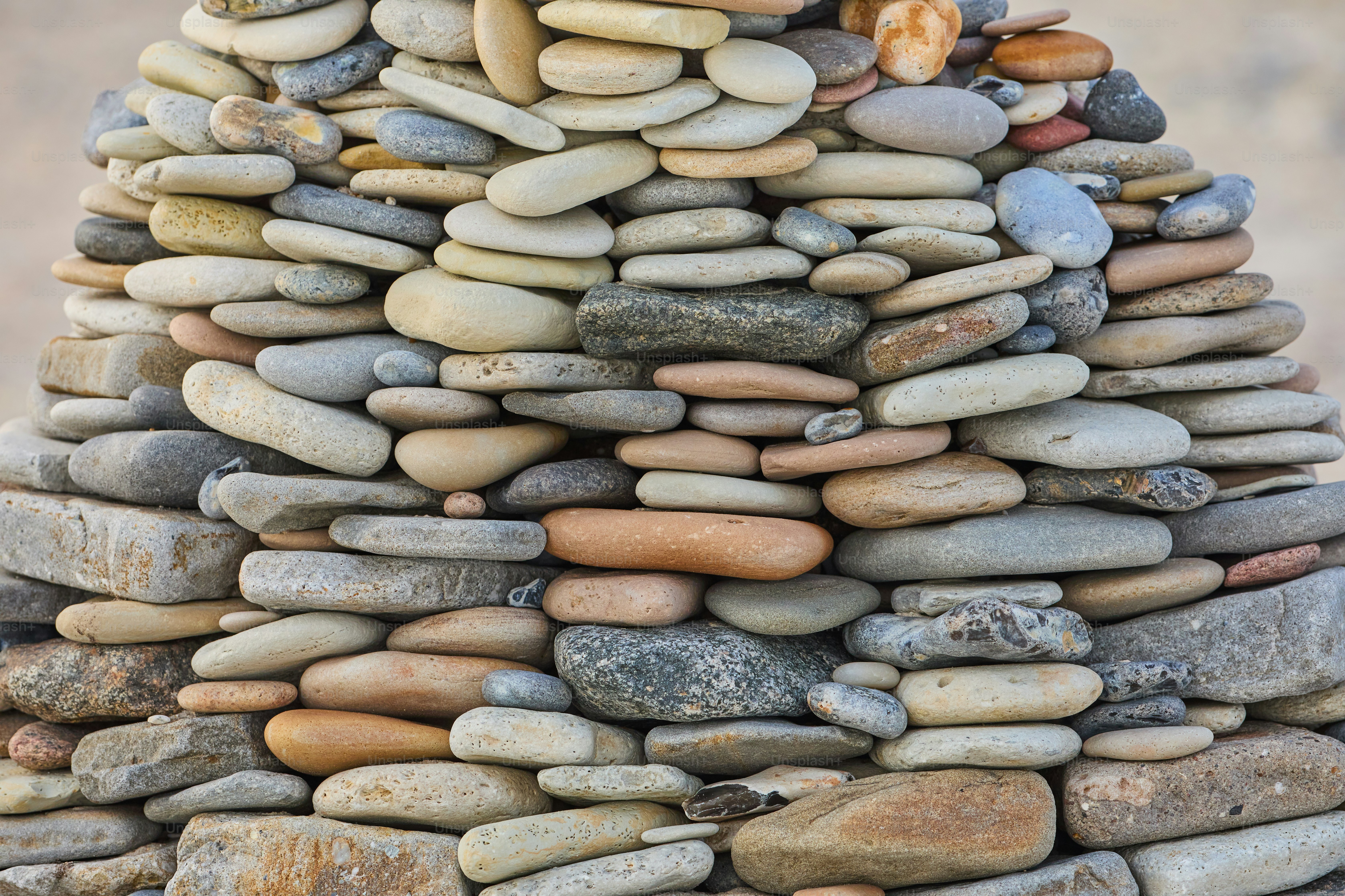 A pile of rocks stacked on top of each other photo – Stones Image on ...