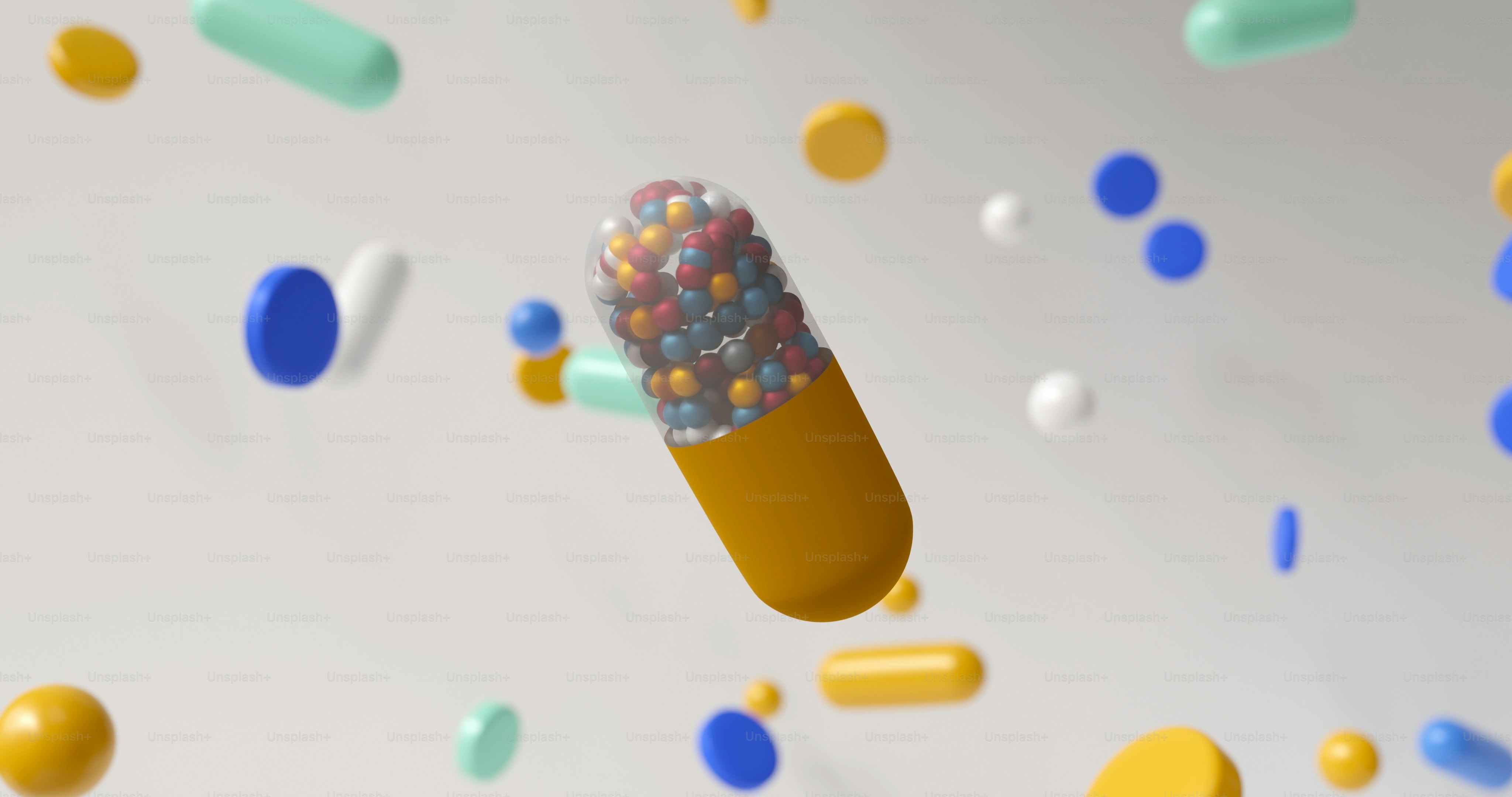 A colorful pill pill surrounded by confetti on a white background photo ...