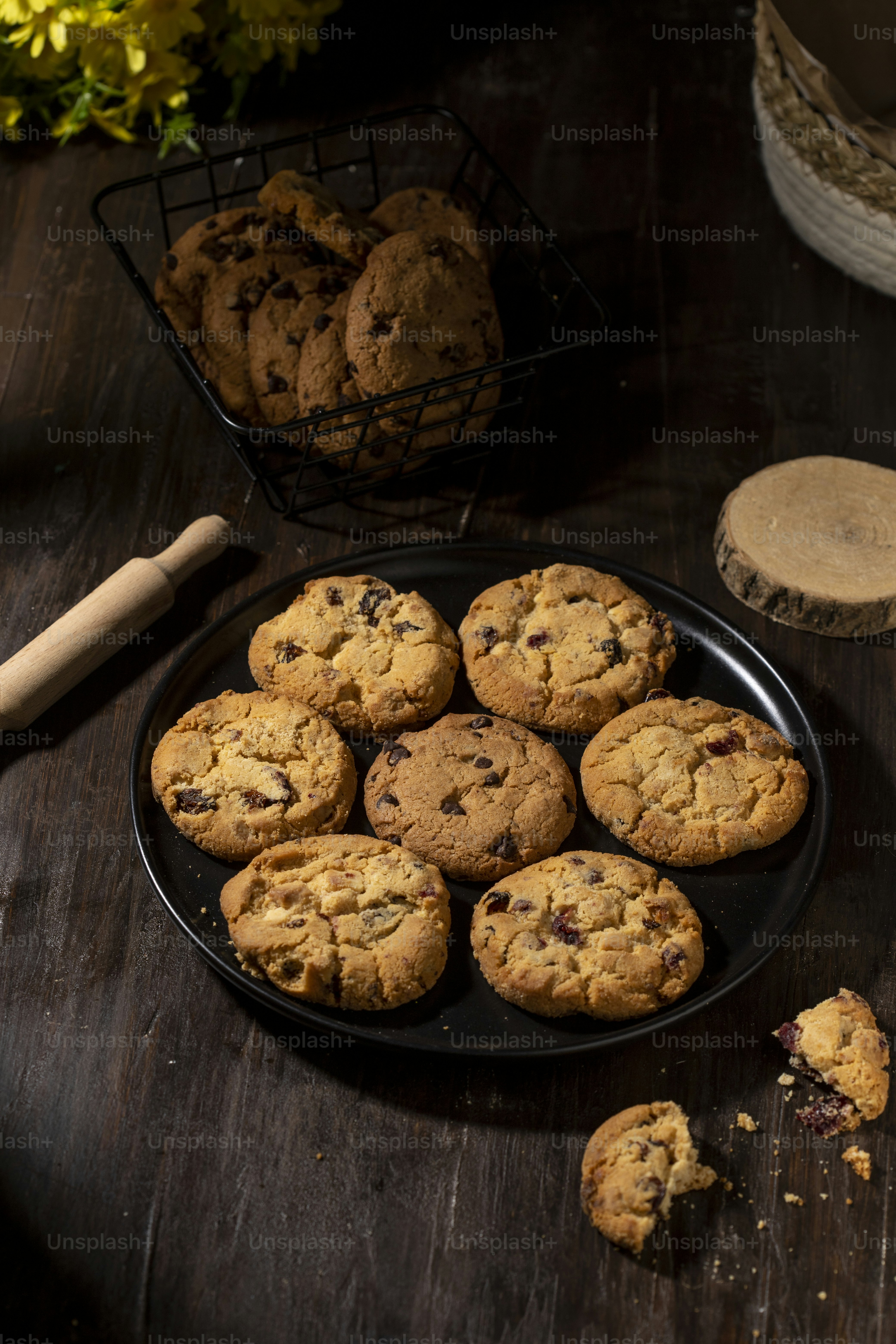 A plate of chocolate chip cookies on a wooden table photo – Chocolate ...